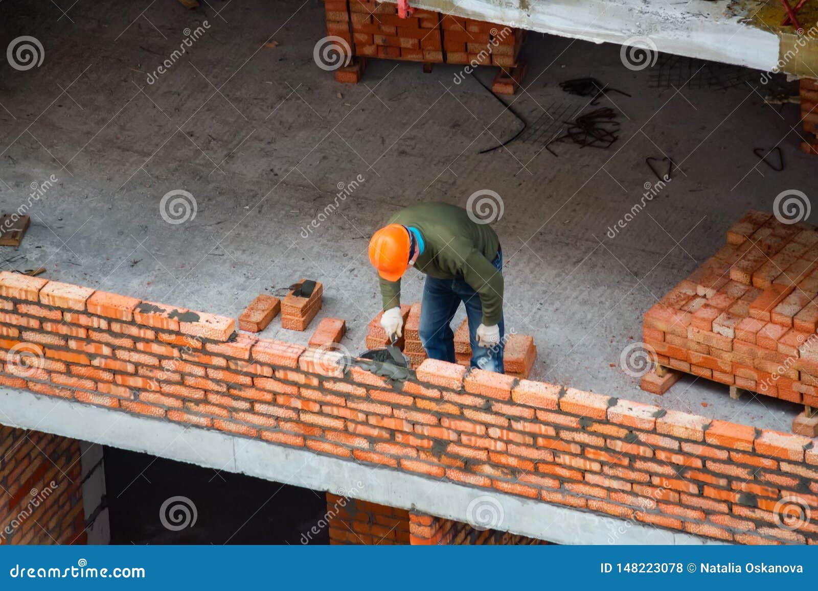 View of Mason Laying Bricks at Construction Site Stock Photo - Image of ...