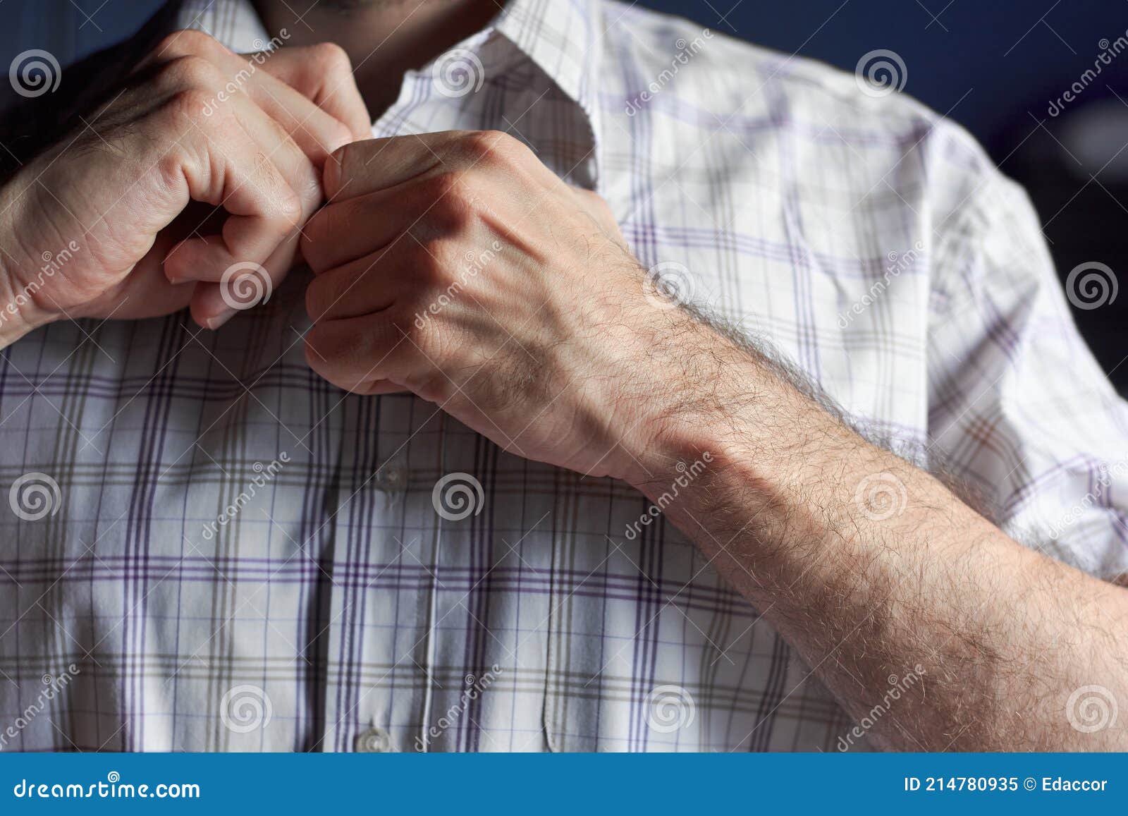 View of Midsection of Young Man`s Body, Hands Buttoning Striped Shirt ...