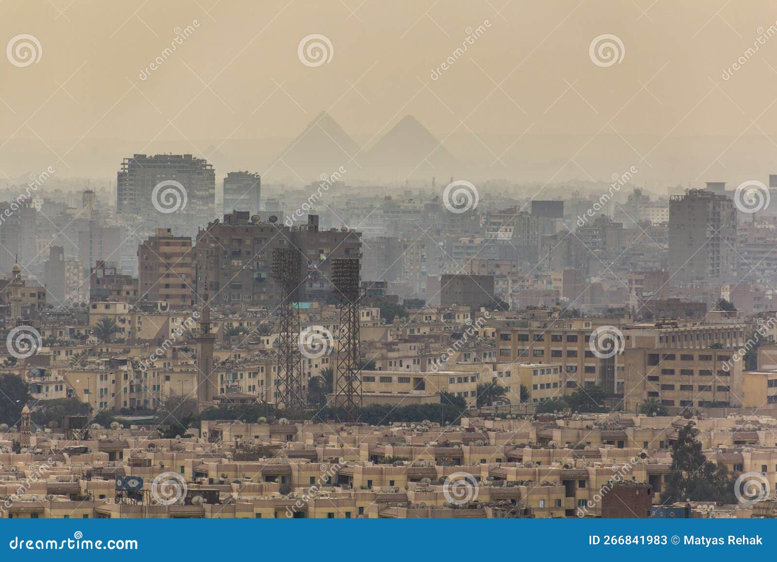 View of Misty Cairo Skyline with Pyramids in the Background, Egy Stock ...