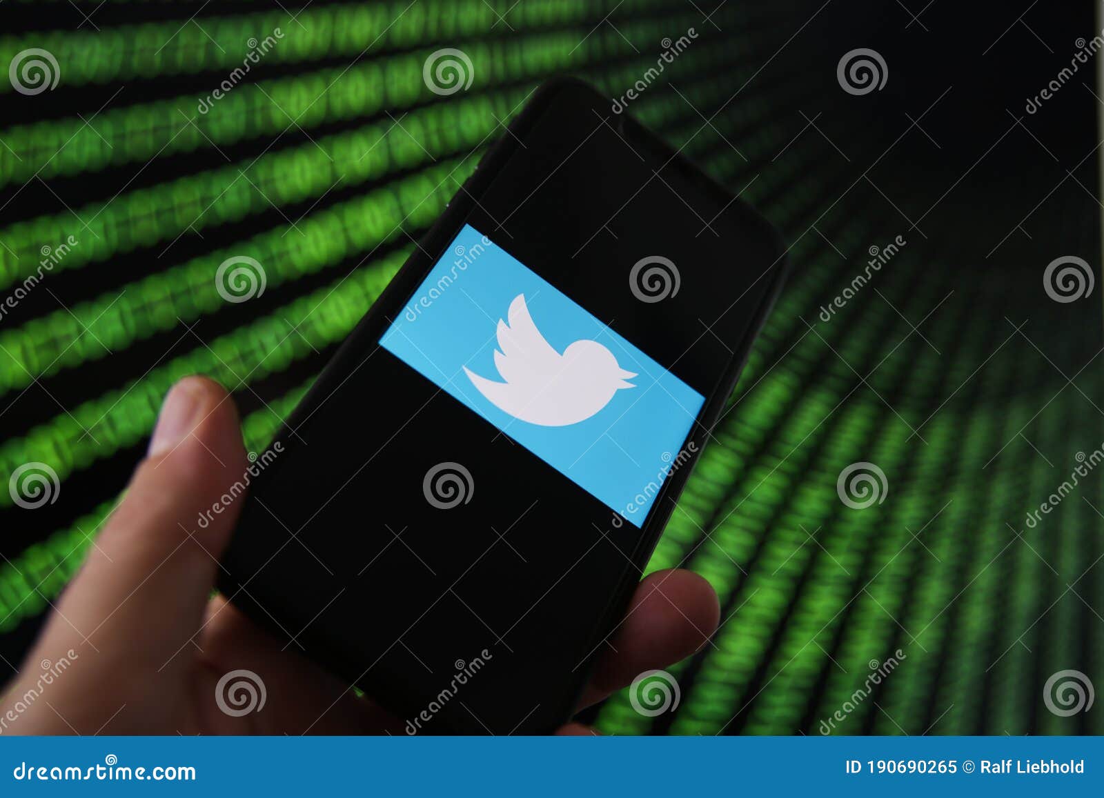 View On Mobile Phone With Twitter Logo Hold By Hand. Screen With Tunnel ...