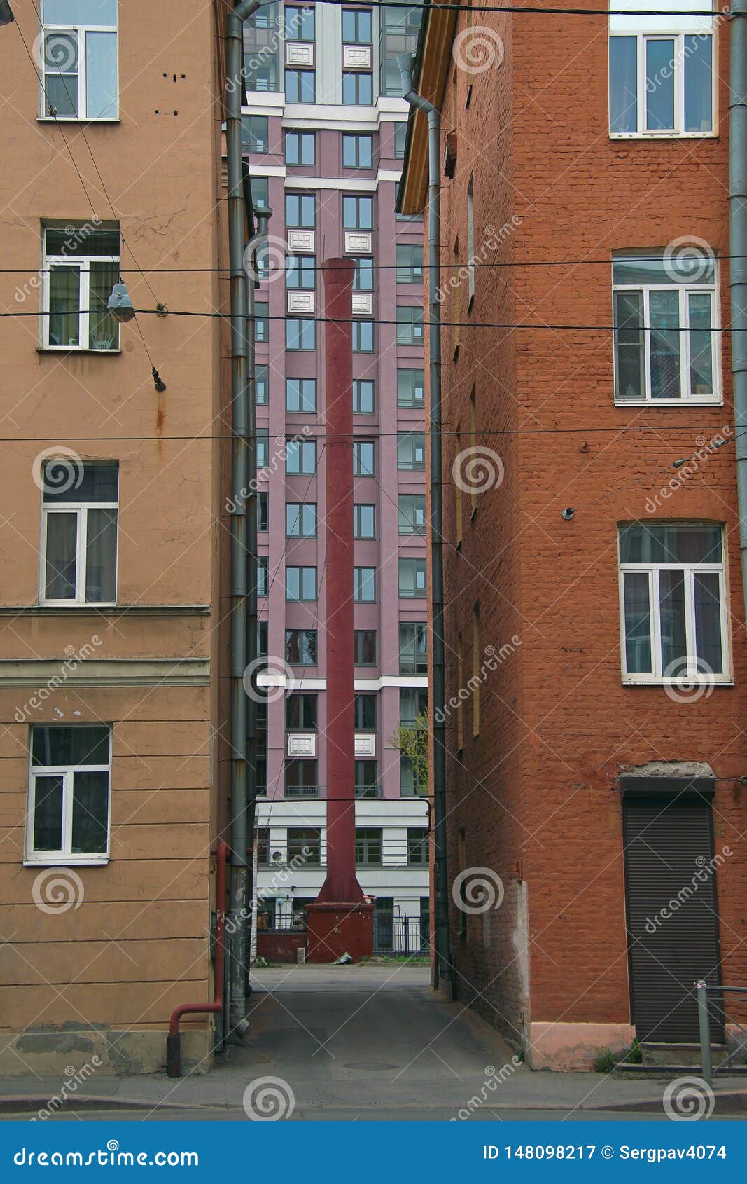 View of a Modern Building in the Passage between the Old Houses Stock ...