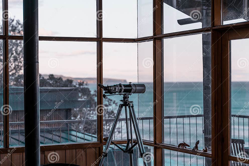 View of a Modern Telescope Placed by the Windows in a Waterside ...