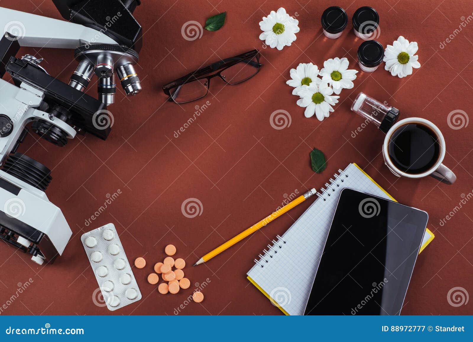 View from the Mountain Microscope with Tablets and Notebook on a Wooden ...