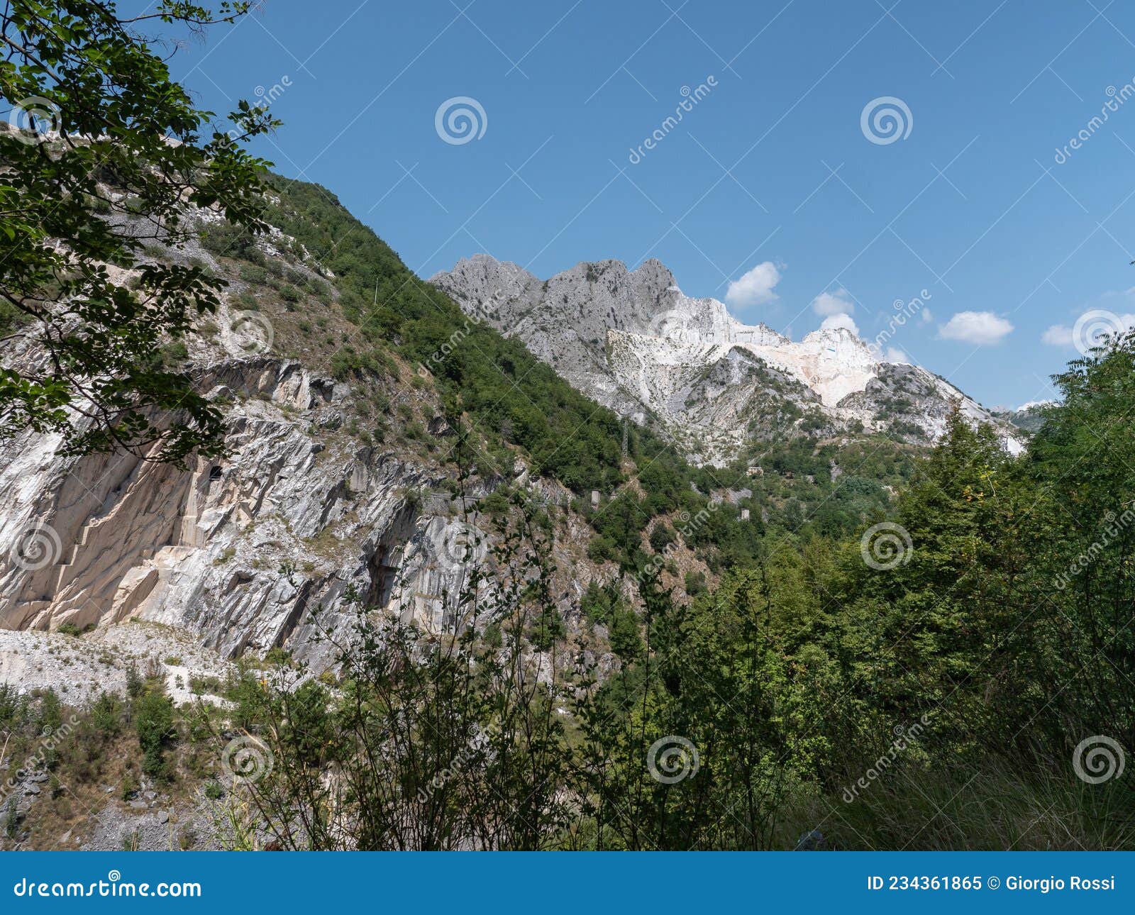 View of a Mountainside in Carrara in Summer Time with Rocks Covered by ...