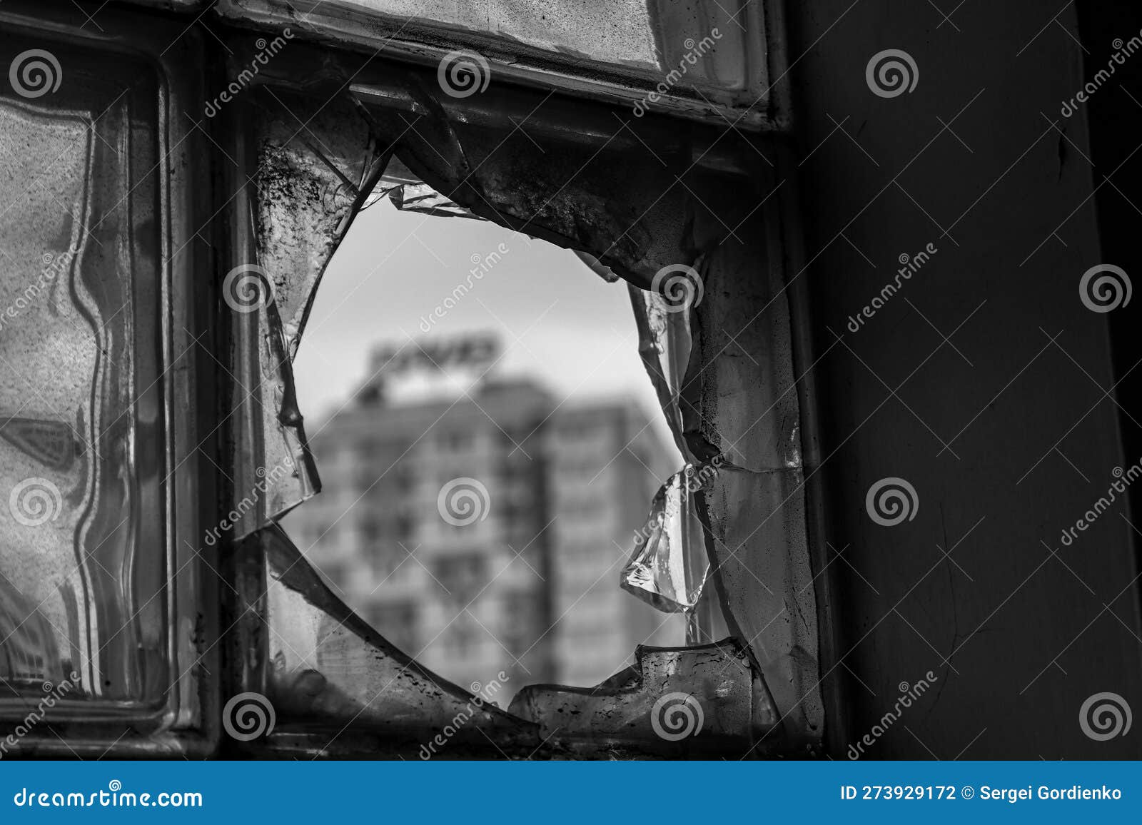 View of a Multi-storey Building through a Broken Window Stock Photo ...