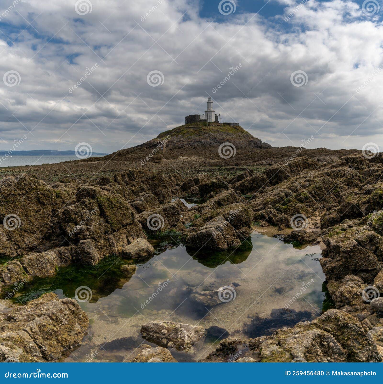 View of the Mumbles Lighthouse in Swansea Bay at Low Tide Stock Photo ...