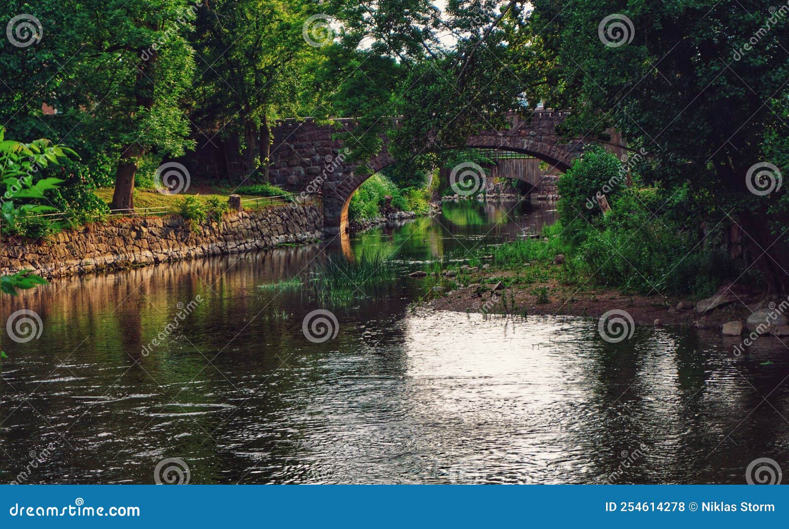 View of Old Stone Bridge Over River Stock Photo - Image of wetland ...