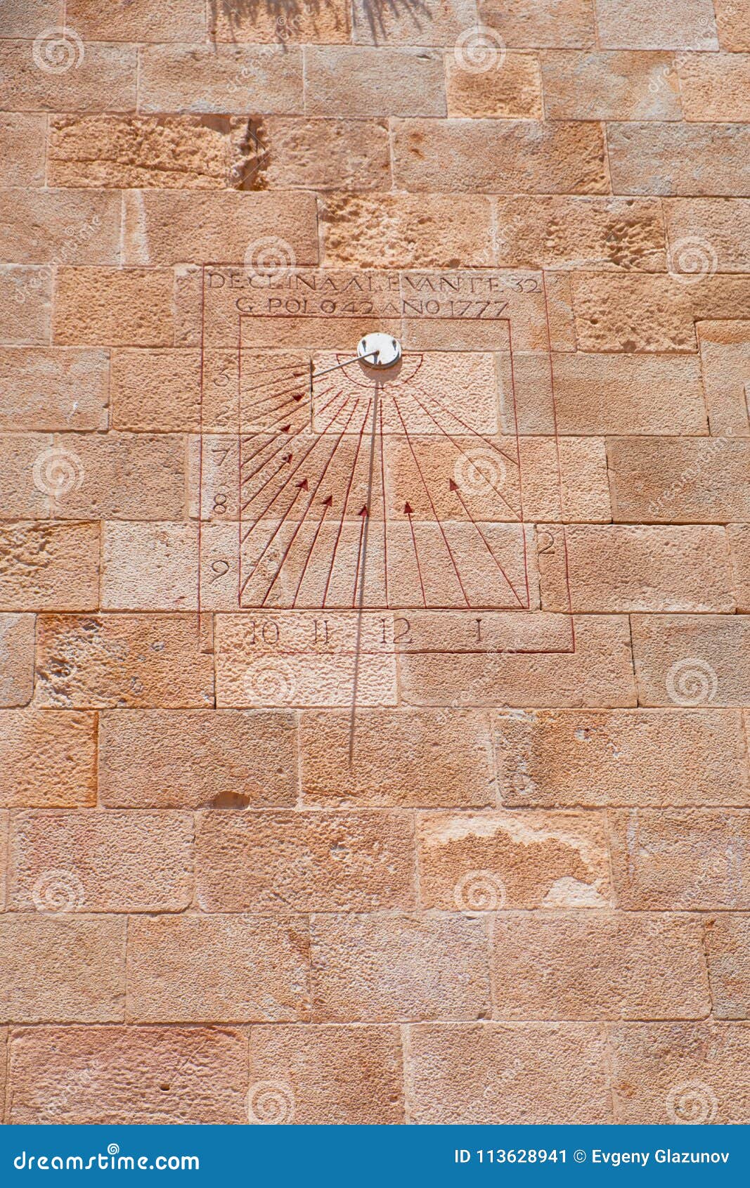 View of an Old Sundial Located on an Ancient Wall. Roman Numbers ...