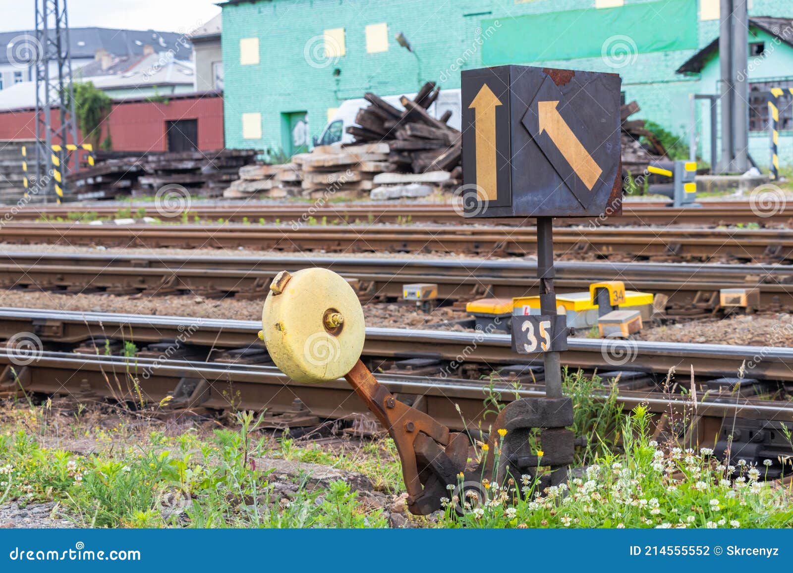 Old Train Switch at the Tracks with a Building in the Background Stock ...