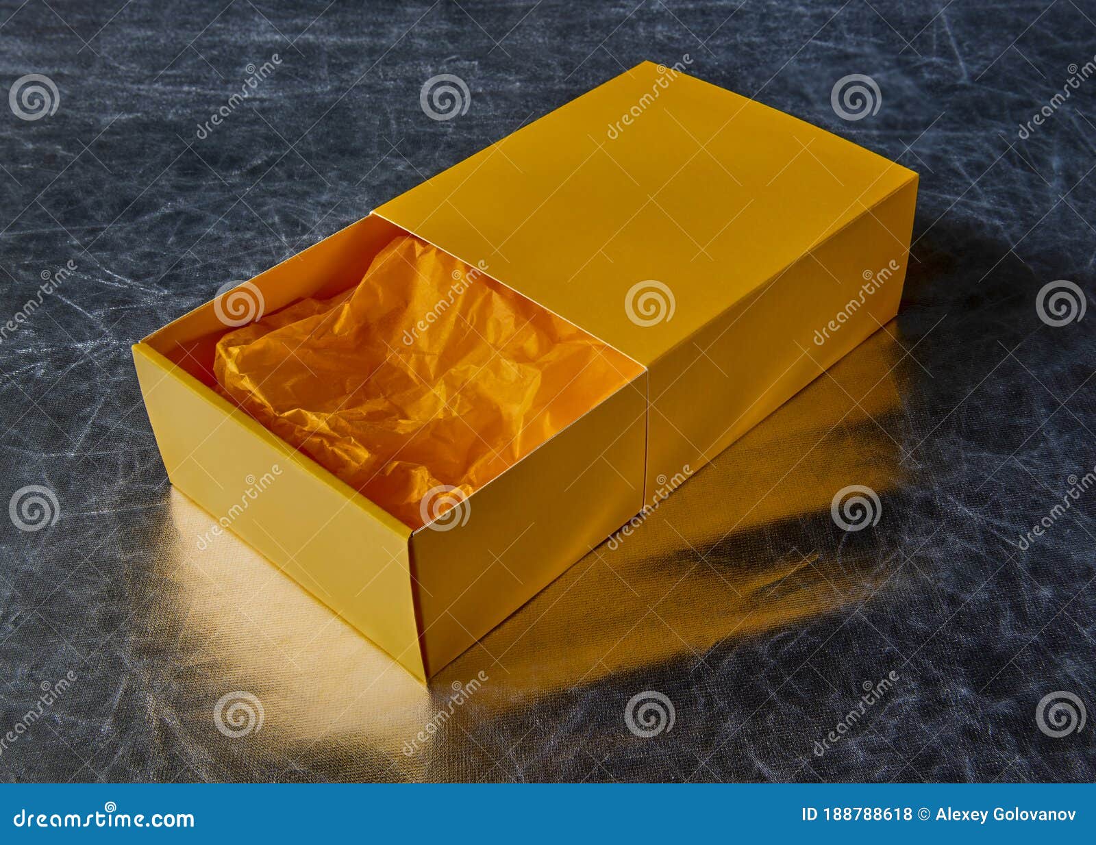 View of an Open Yellow Gift Box with Packaging Paper Inside Stock Photo ...