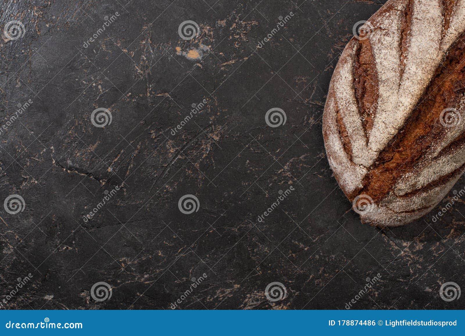 View of Organic Brown Bread Loaf on Stone Black Surface Stock Photo ...