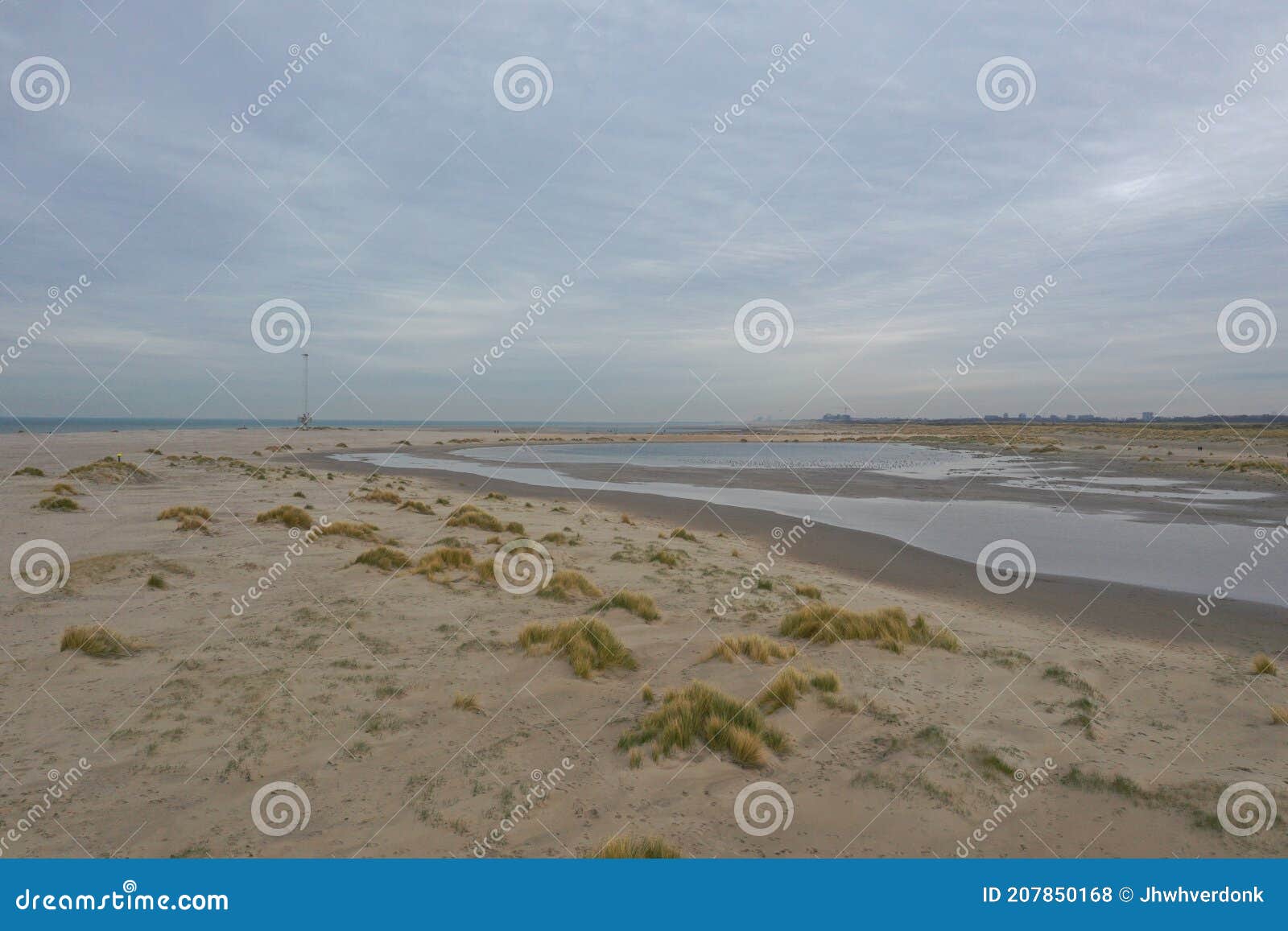 View Over a Large Beach with Many Water Puddles Covering the Beach ...
