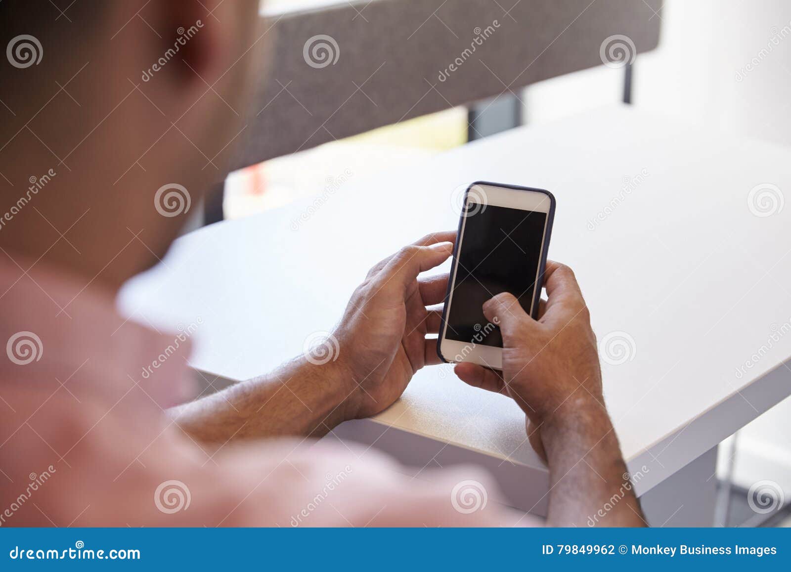 View Over the Shoulder of Male Student Using Mobile Phone Stock Photo ...