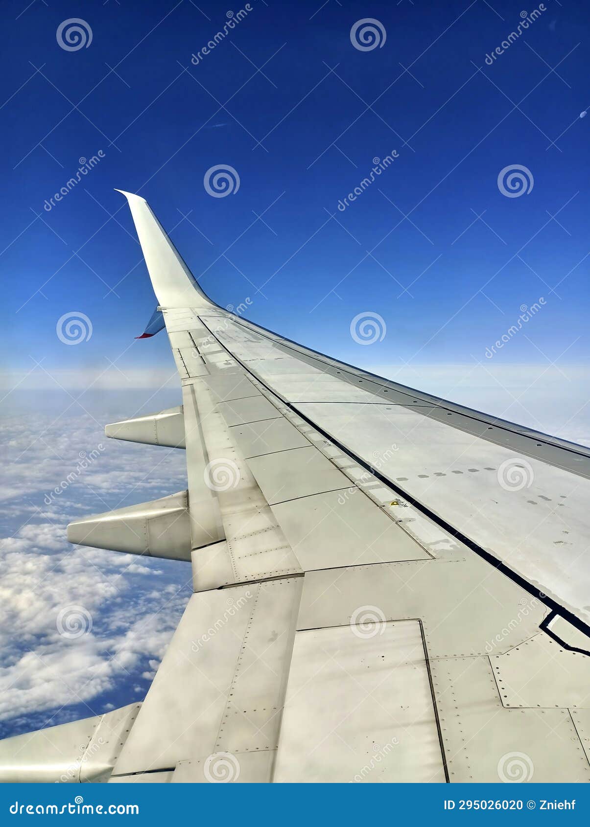 View Over the Wing of a Passenger Aircraft from High Altitude on the ...
