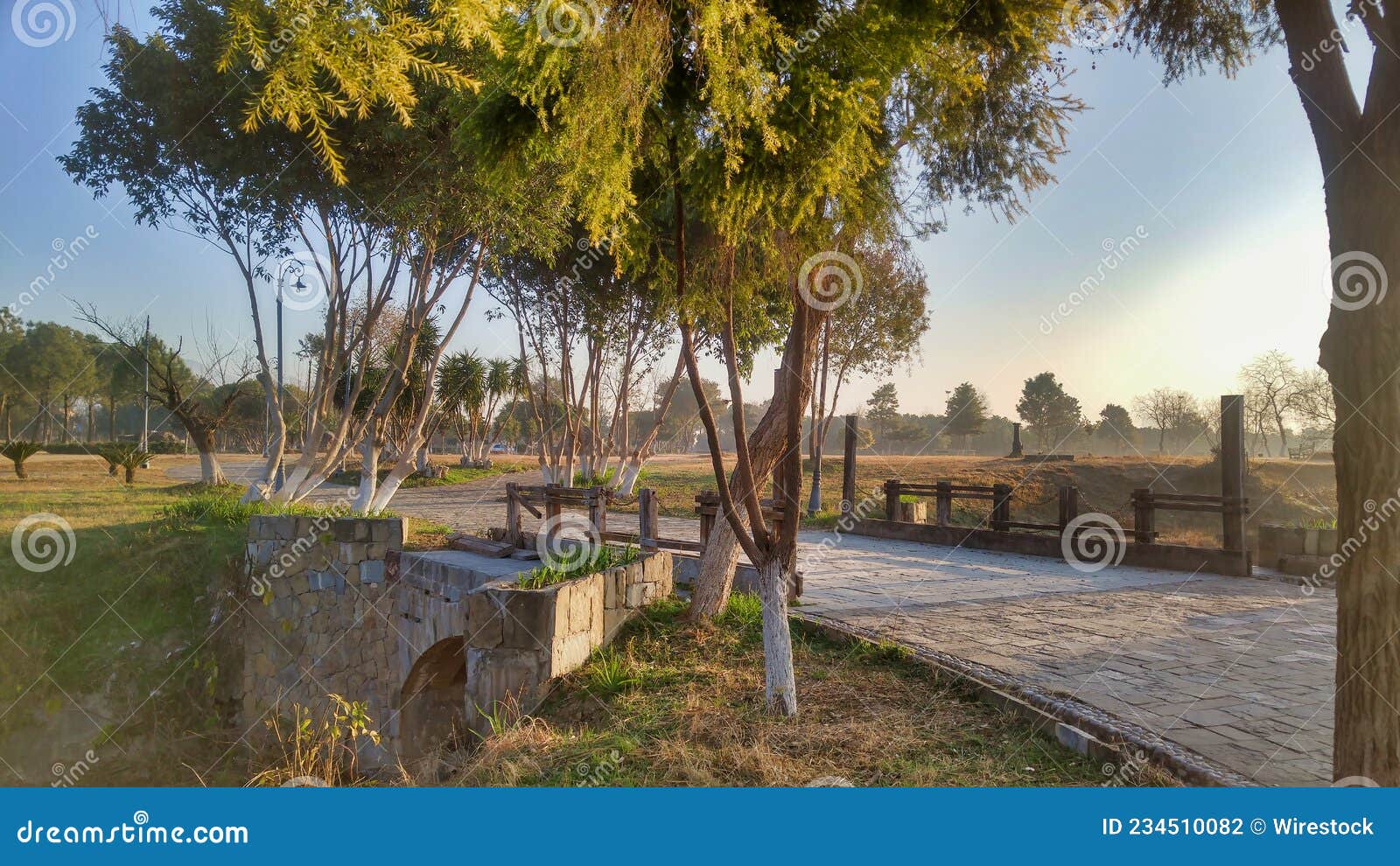 View of a Park and Walking Path on a Winter S Evening with an Overcast ...