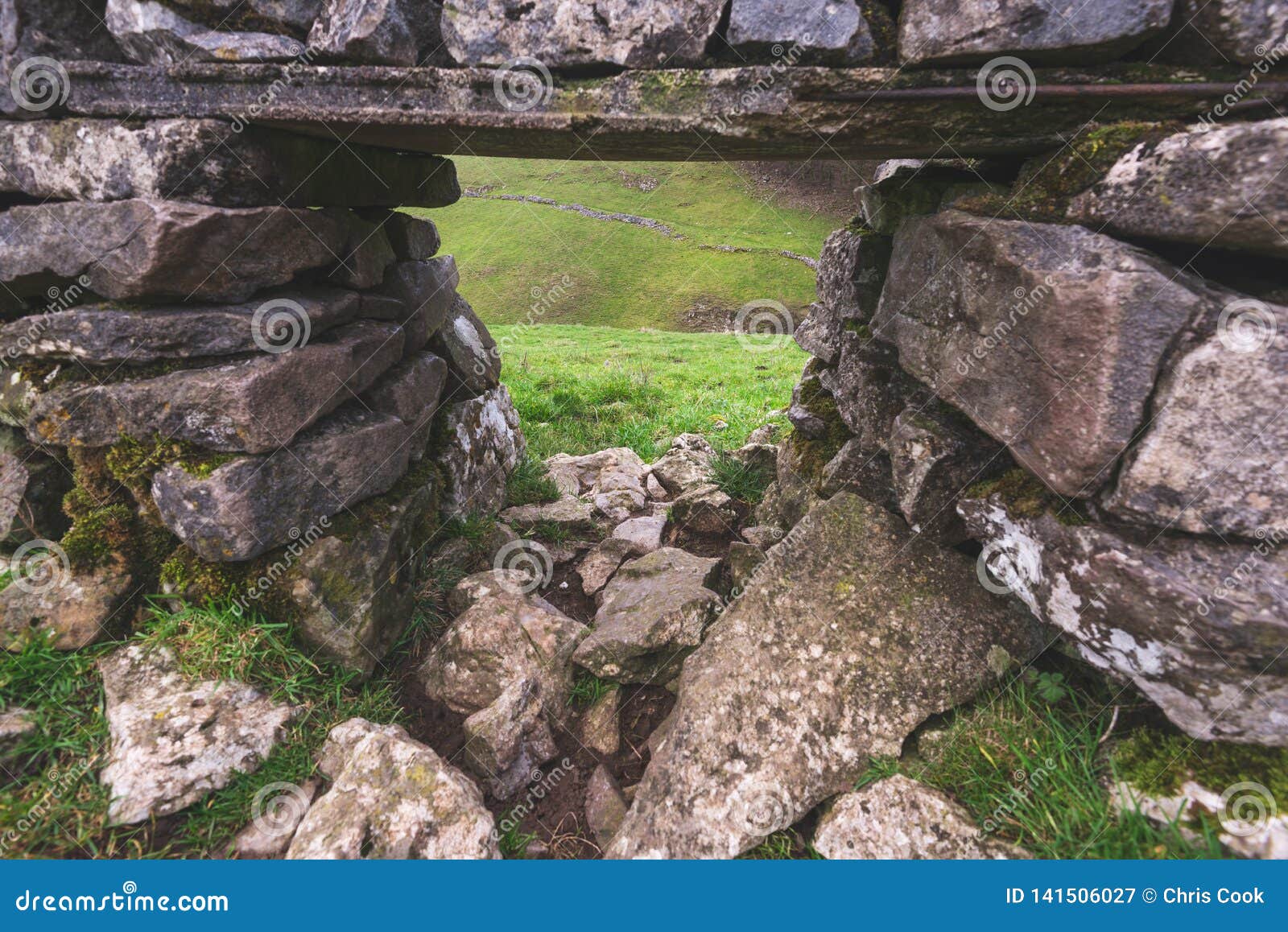 A View of the Peak District through a Hole in a Wall Made from Rocks ...