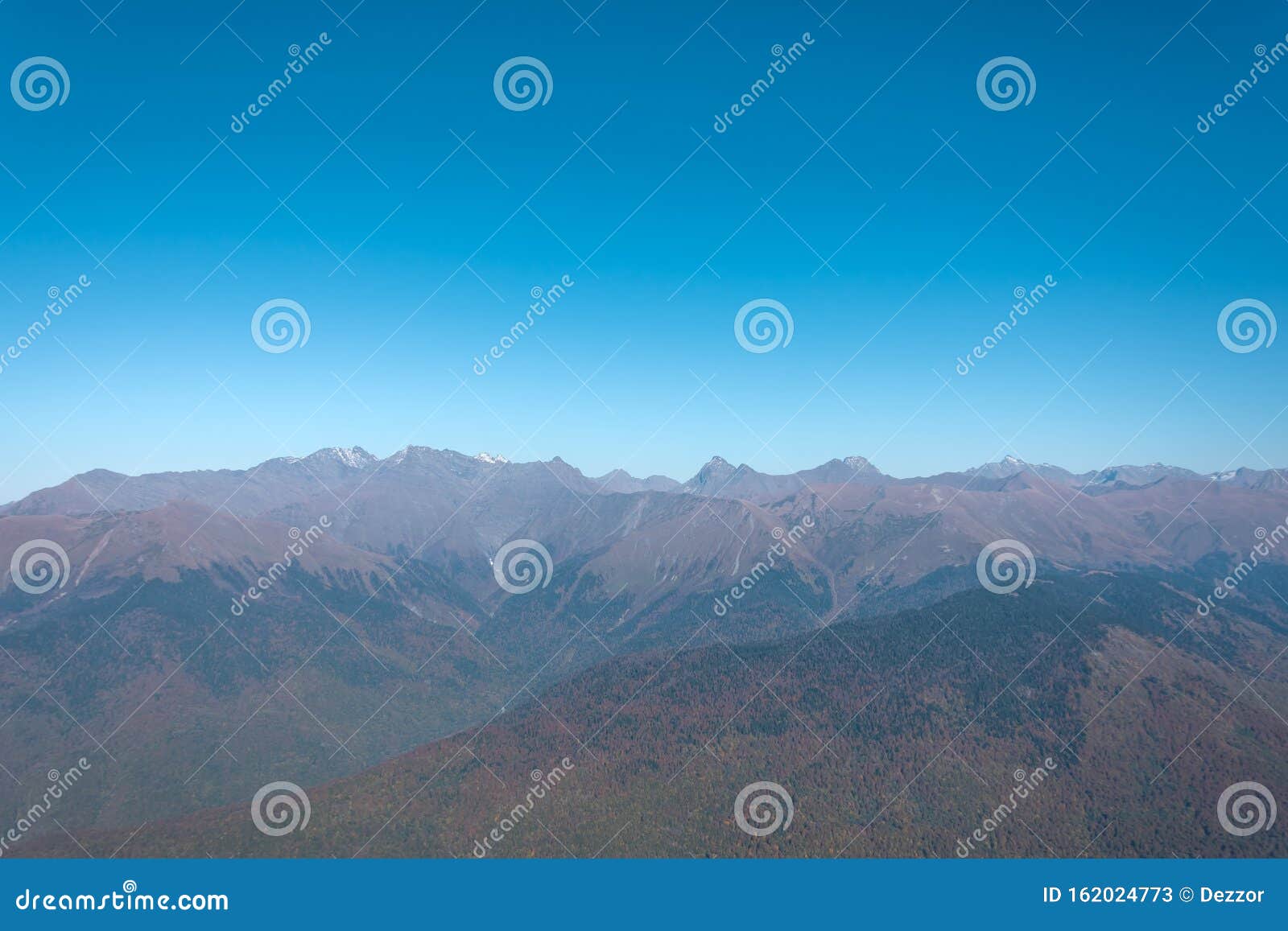 View of Peaks and Mountains in the Distance and Clear Blue Sky Stock ...