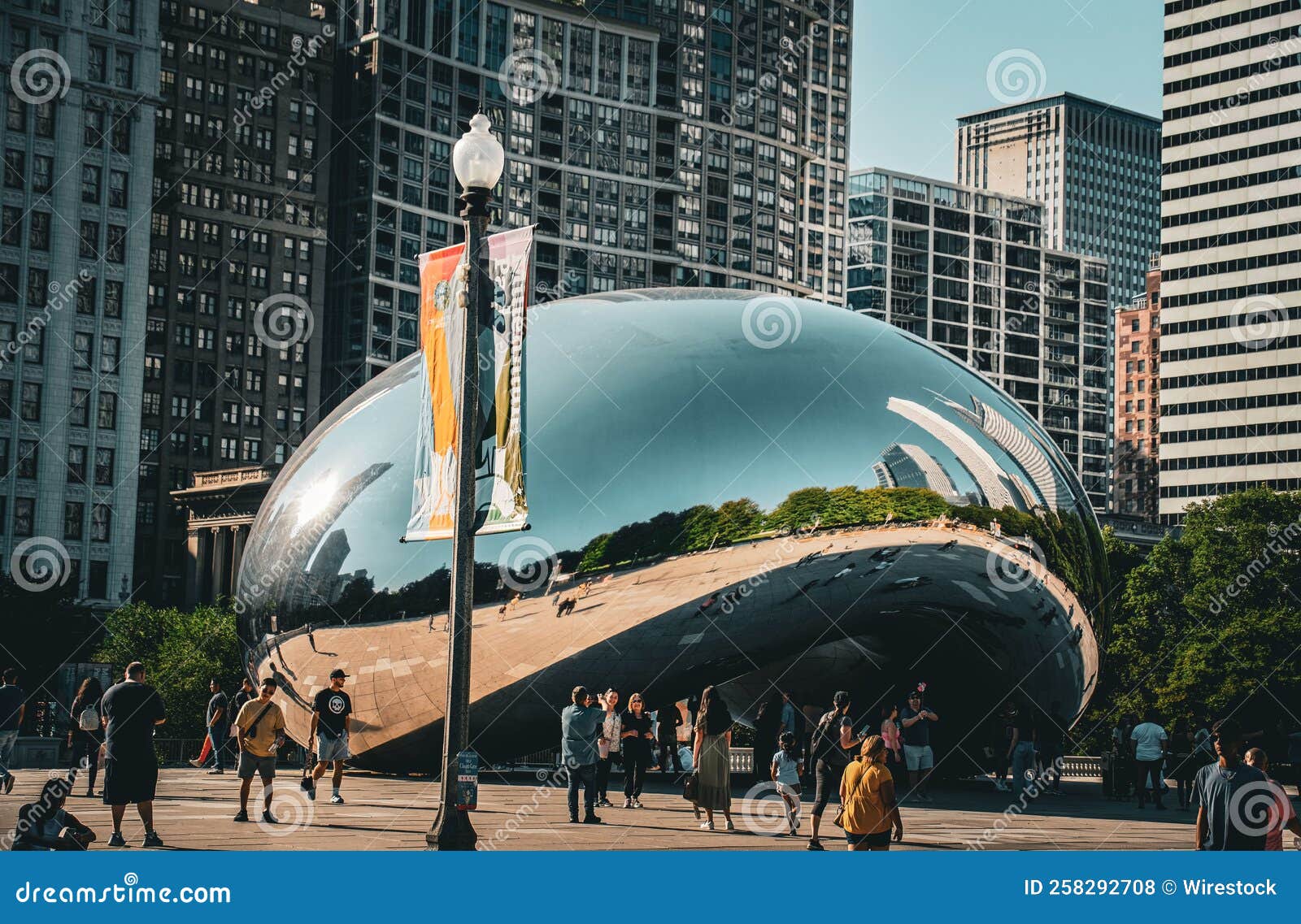 View of People Walking by the Cloud Gate before the Buildings at ...