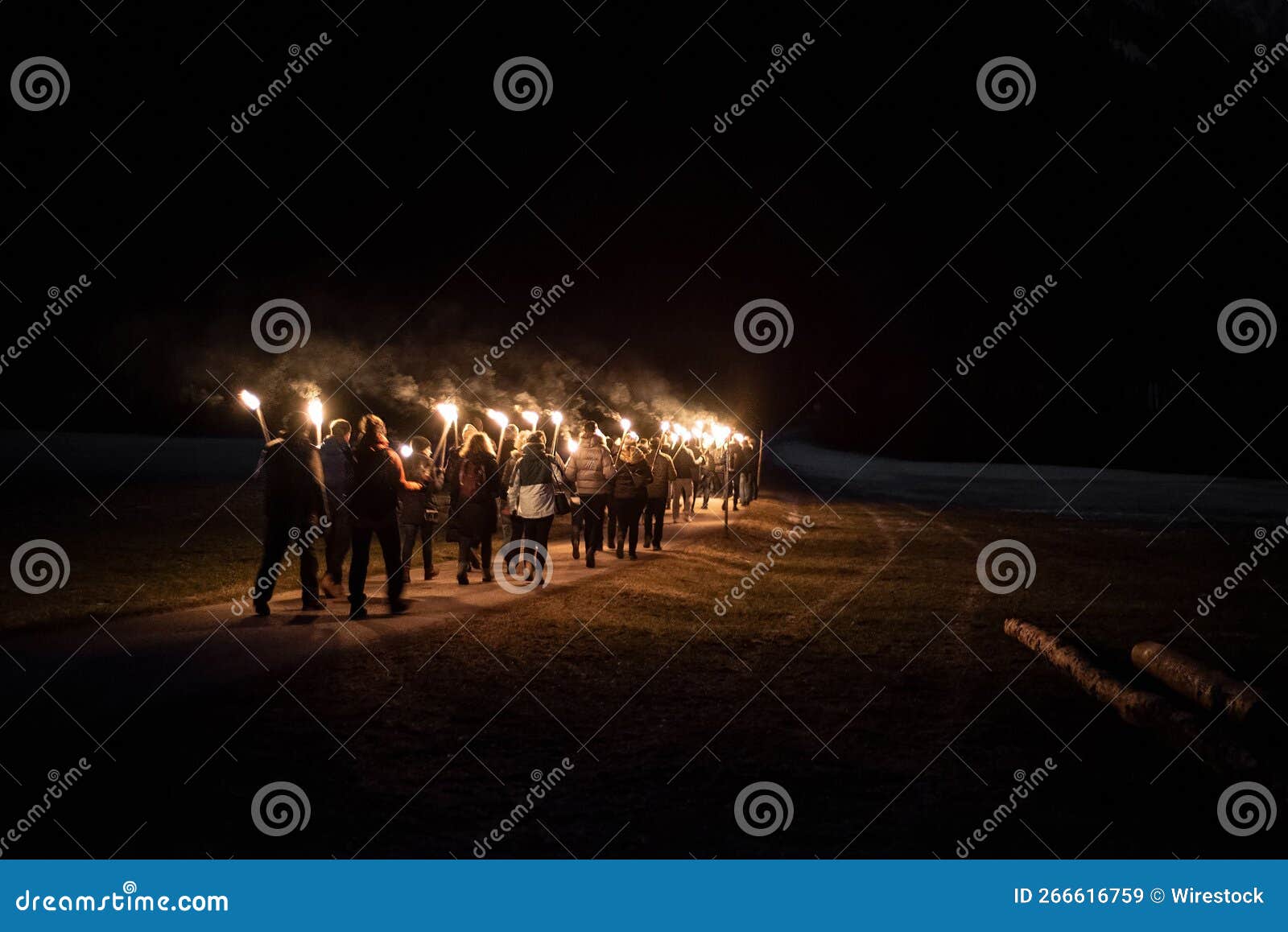 View of People Walking with Torches in a Dark Street during the Night ...