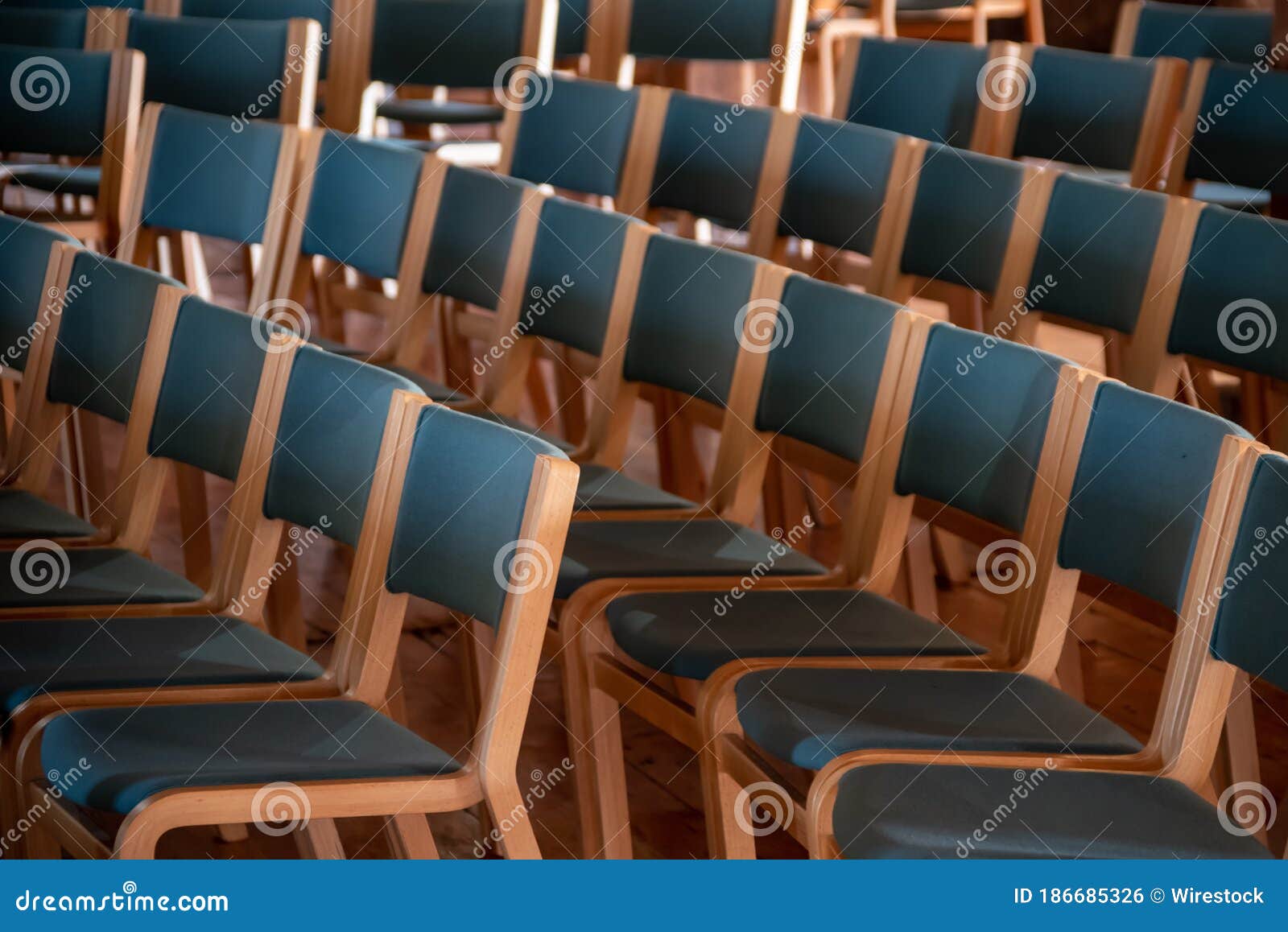 View of Perfectly Aligned Empty Wooden Chairs on a Conference Hall ...