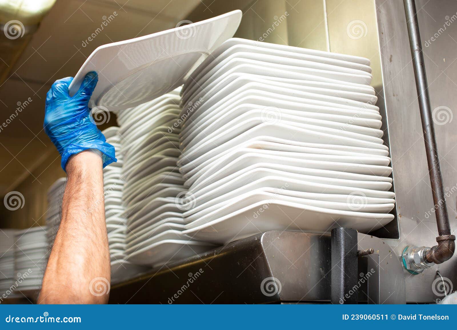 Hand Grabs from Plate Stack Stock Image - Image of fork, hand: 239060511