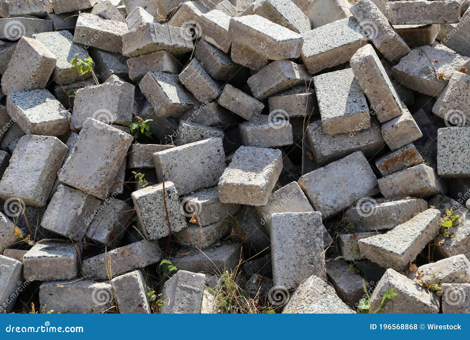 A Pile Of Concrete Rubble With Protruding Rebar On The Background Of ...