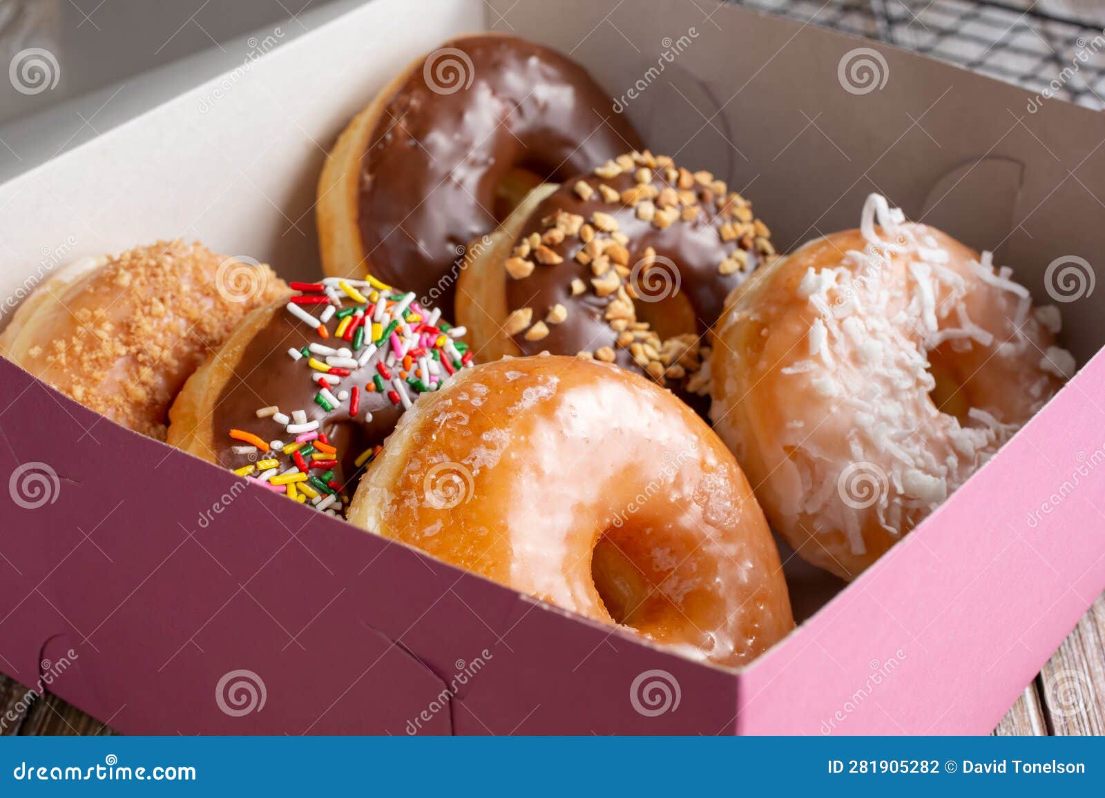 Pink Box Full of Assorted Donuts Stock Photo - Image of placemat ...