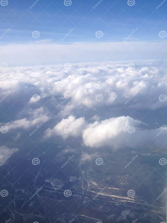 View Above the Clouds. White Clouds that Rise Above the Ground. View ...