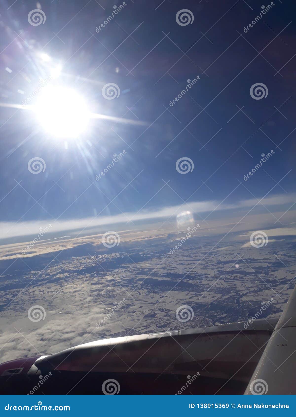 View from the Plane on the Clouds, the Distant Land and the Wing. Stock ...