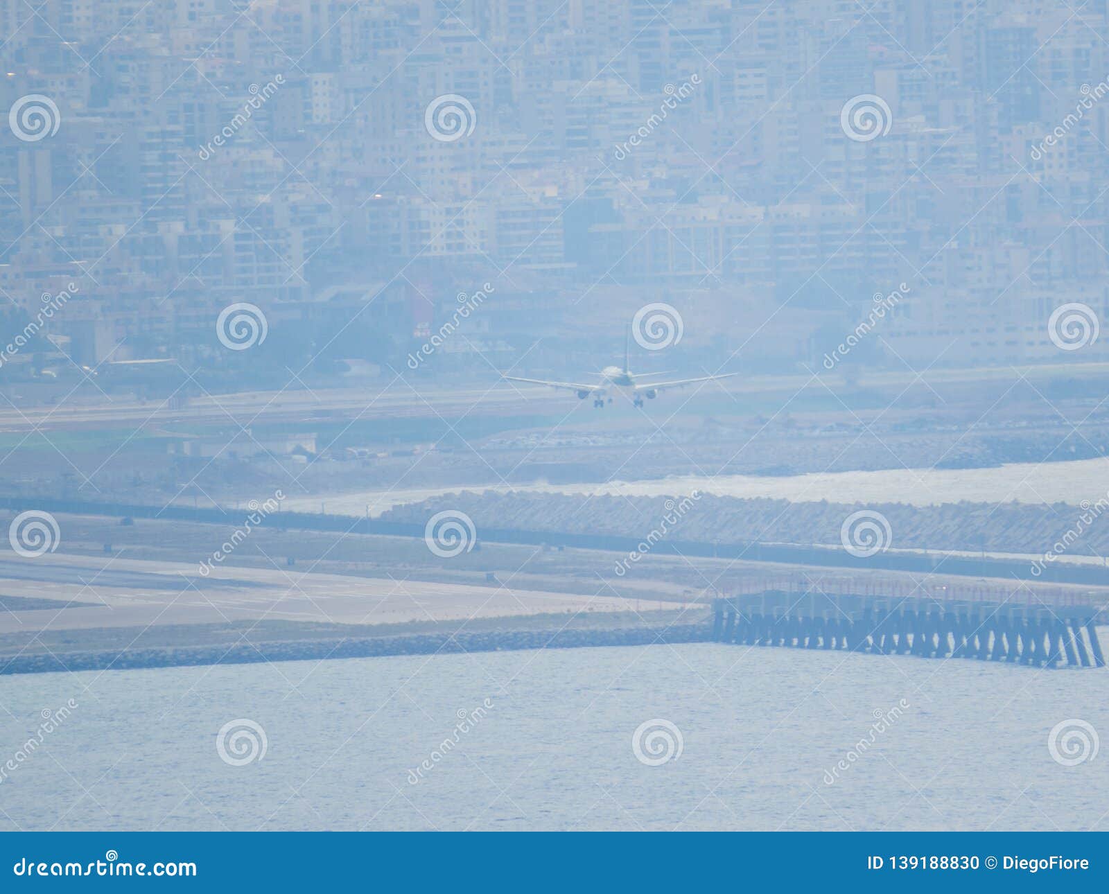 Plane Landing in Beirut, Lebanon Stock Photo - Image of blue, clouds ...