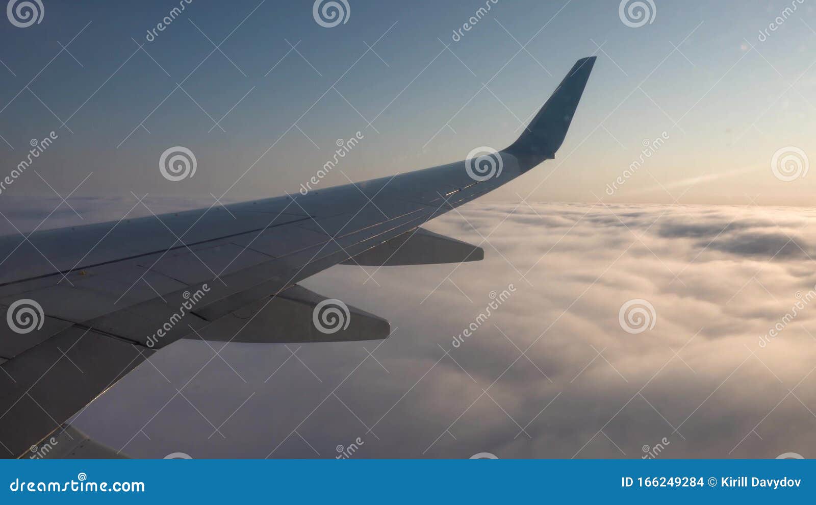 View from the Plane Window. Wing and Sky in the Window of the Plane ...