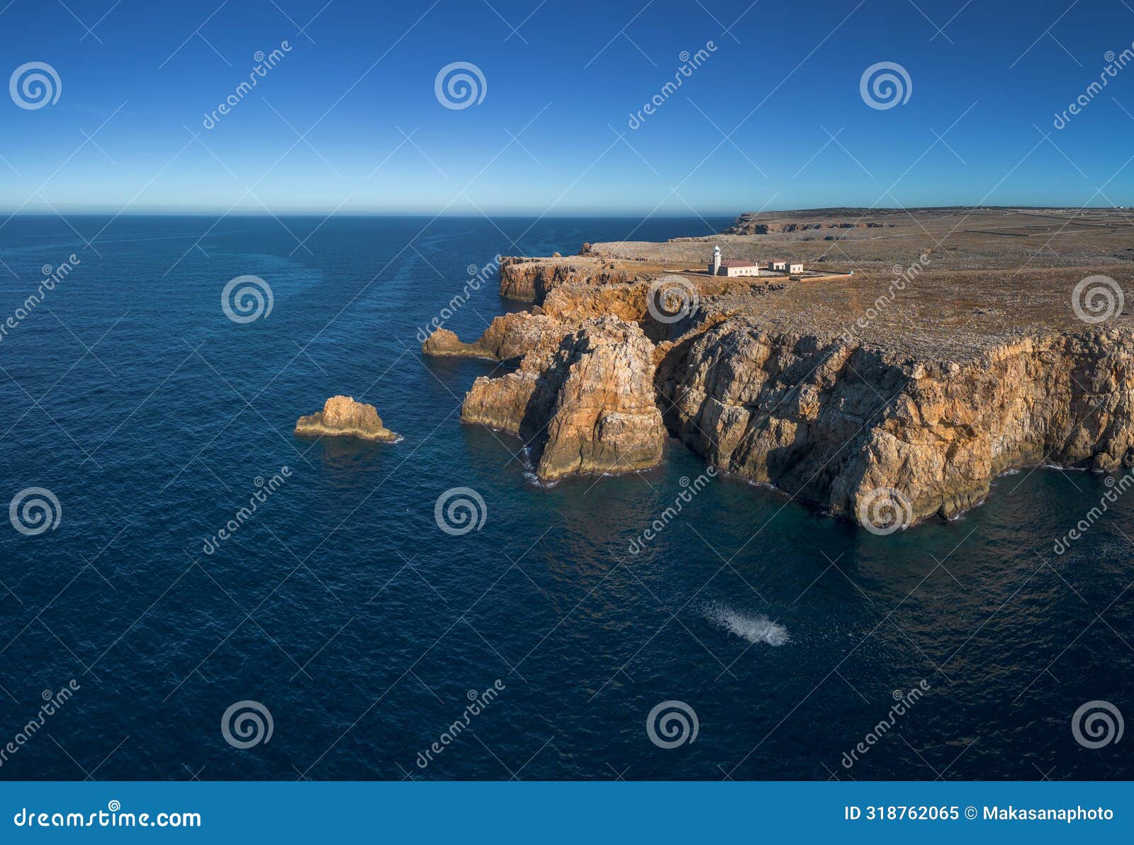 View of the Punta Nati Lighthouse and Coastal Cliffs in Northwestern ...