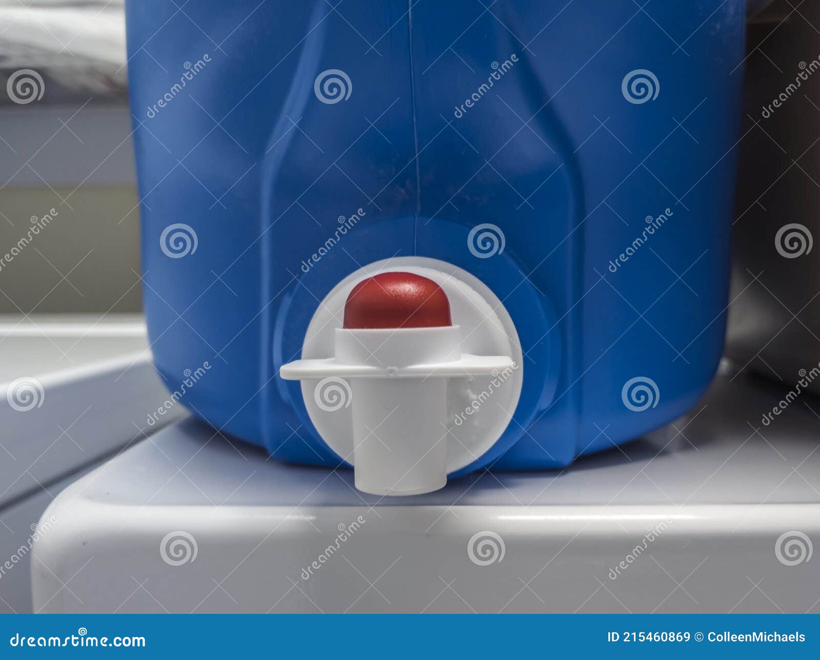 View of a Push Button Top Jug of Liquid Laundry Detergent on Top of a ...