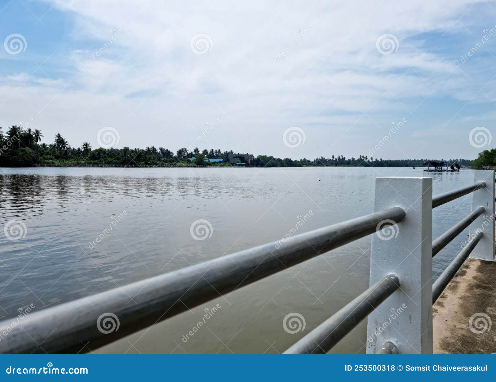 Railing on the riverside stock photo. Image of blue - 253500318
