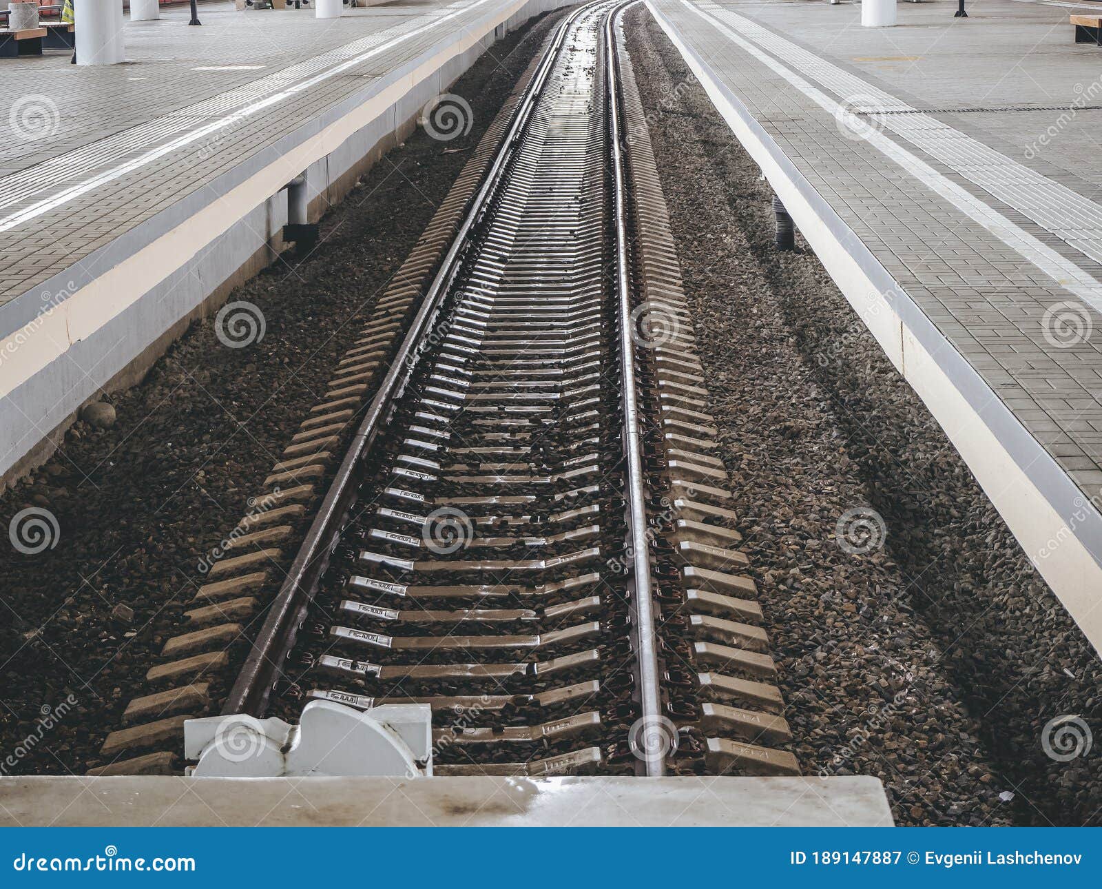 View of the Railway Rails and Sleepers and High Side Platforms. Long ...