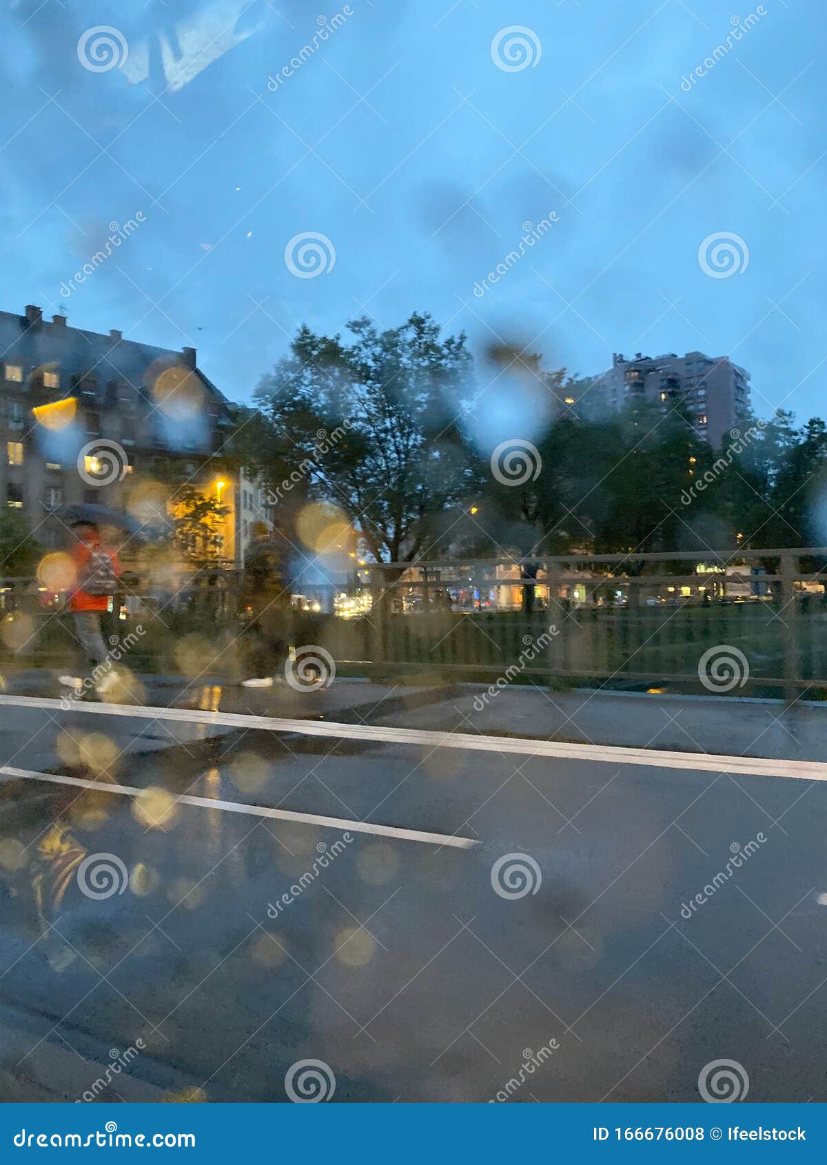 View through the Rainy Windshield of a Car at the Unrecognizable ...