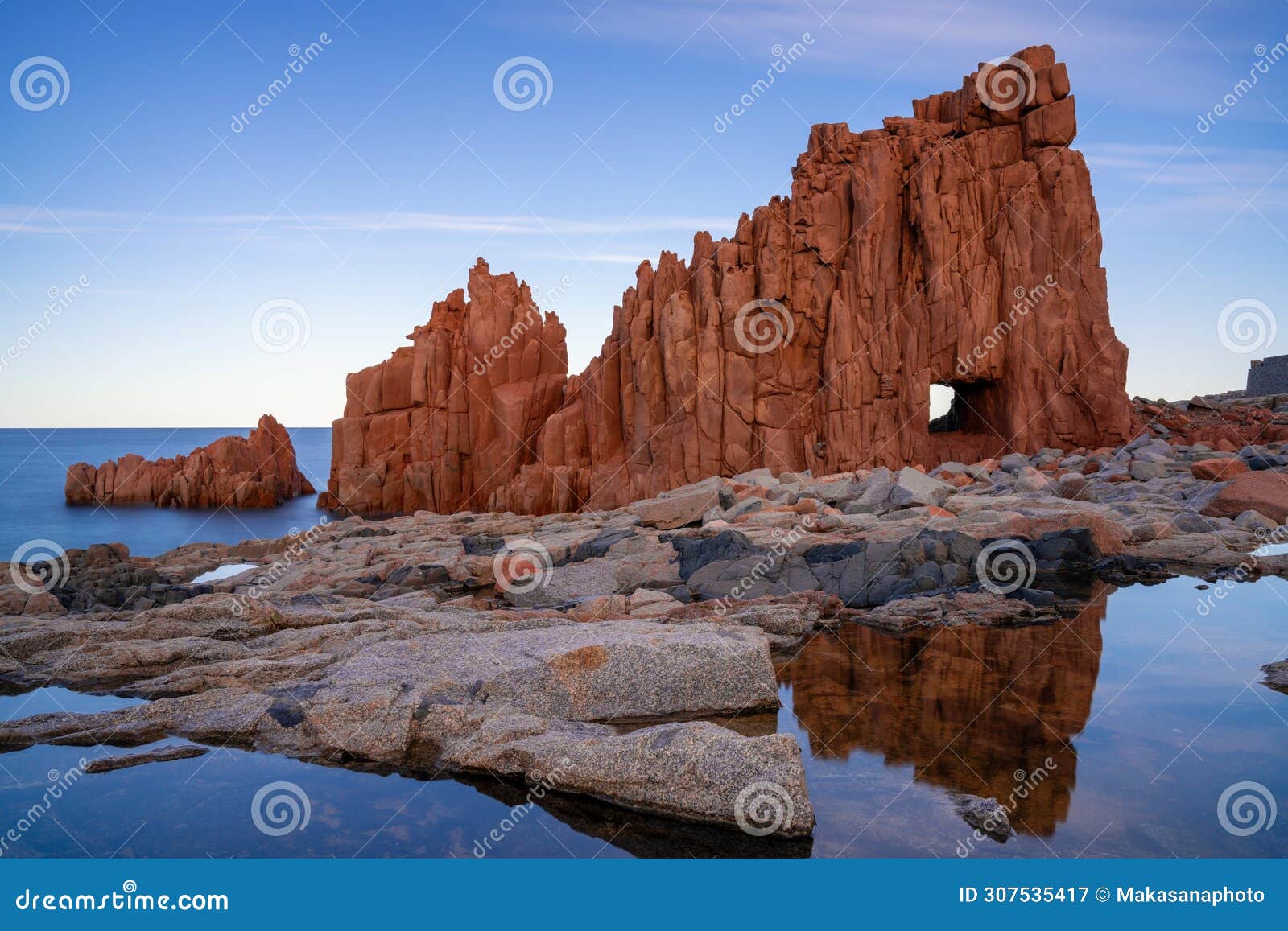 View of the Red Rocks of Arbatax with Reflections in Tidal Pools in the ...