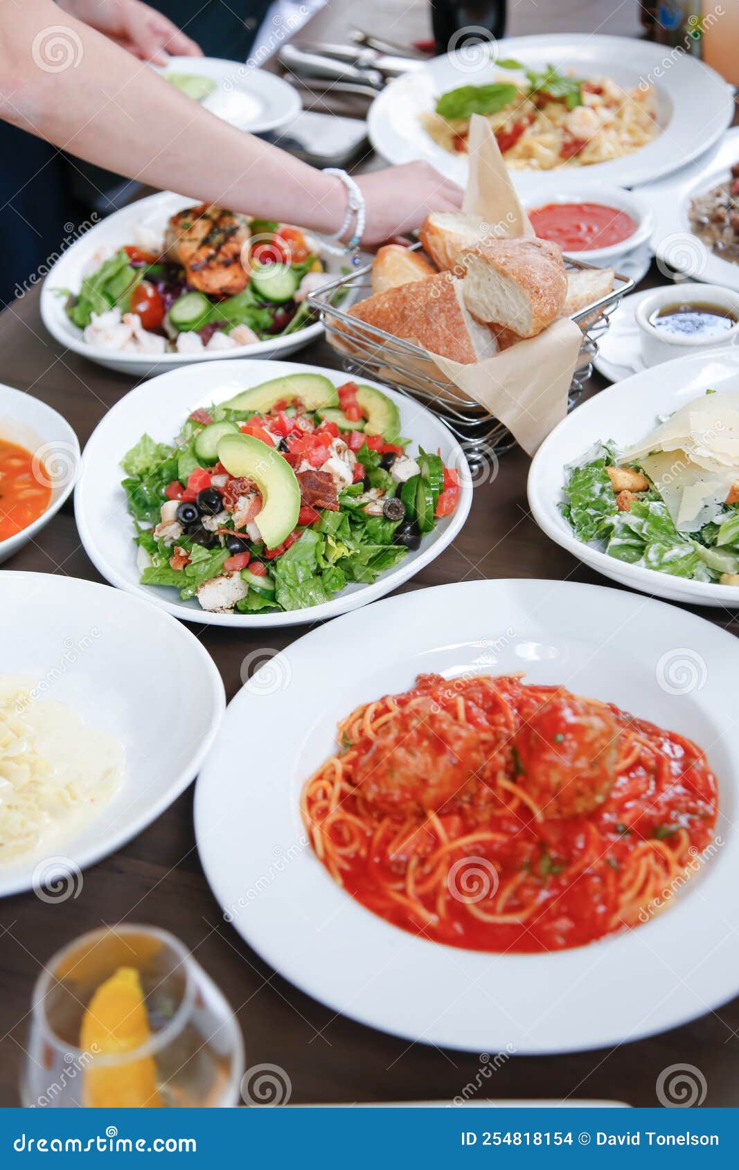 Assorted Entrees, House Bread, Spaghetti Meatballs, Salad Stock Photo ...