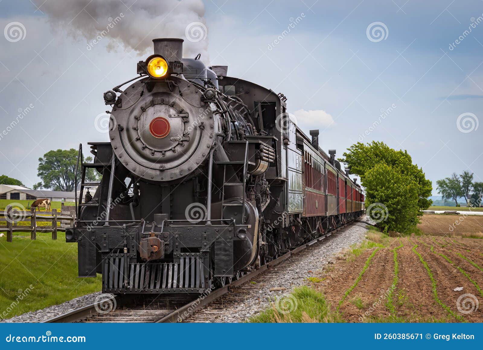 View of a Restored Steam Train Approaching Head-on Blowing Smoke and ...