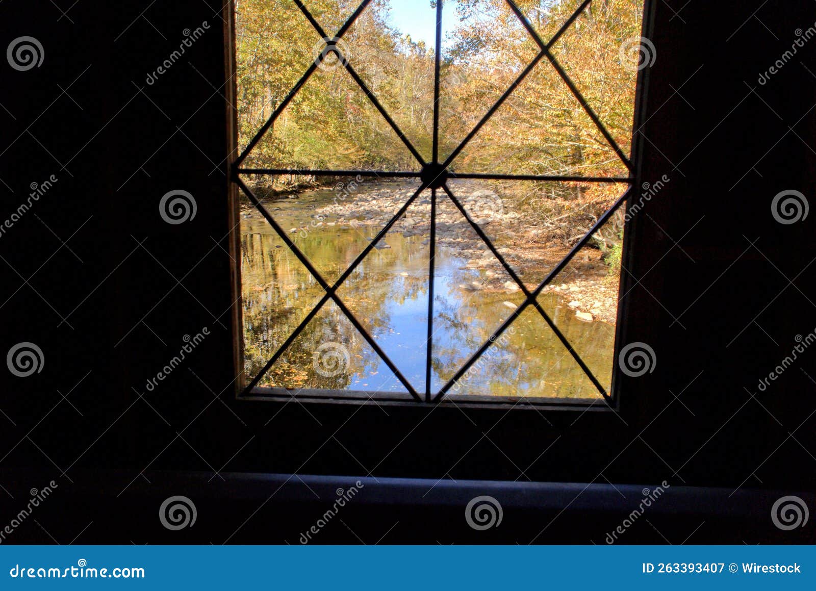 View of the River with Autumn Trees from the Window in a Dark Room ...