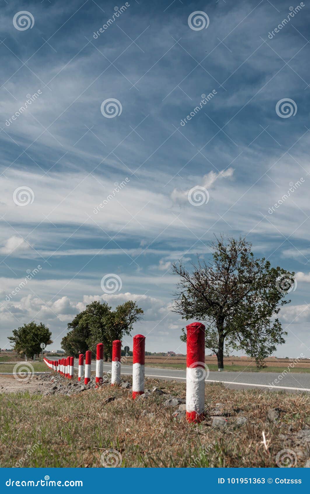 View of a Road and Red-white Pillars Stock Image - Image of blue ...
