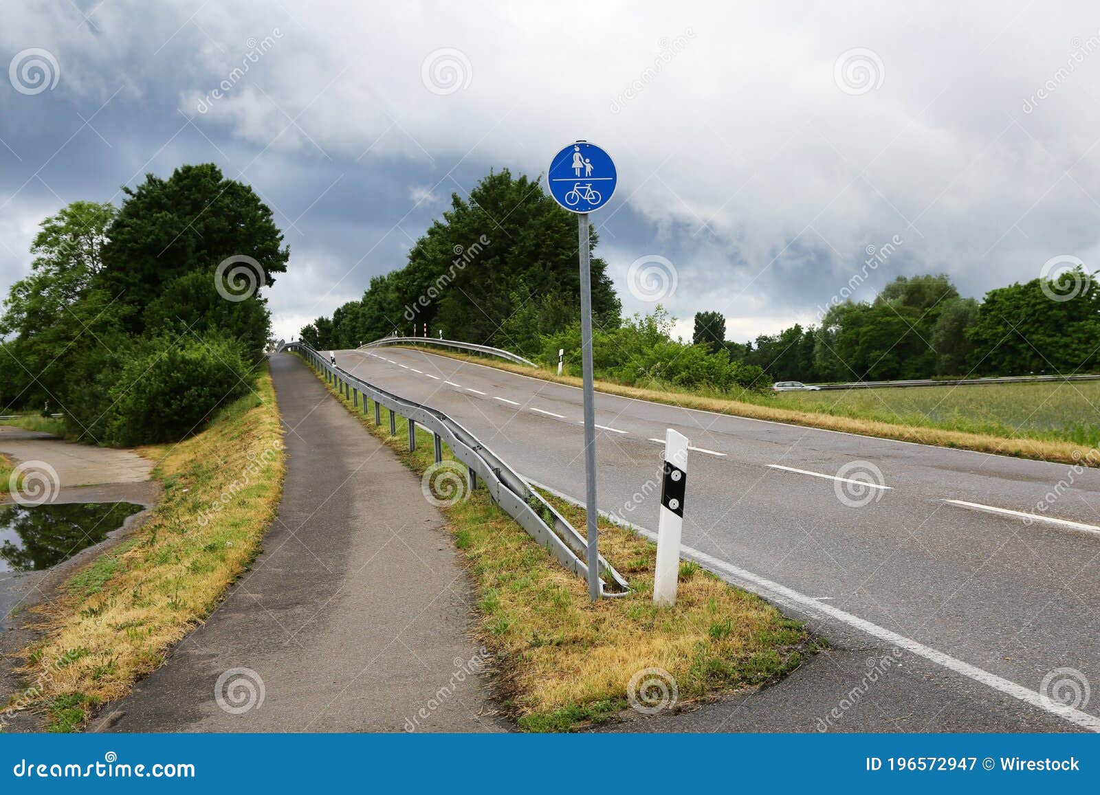 View of a Road and a Footpath with Signage Stock Image - Image of ...