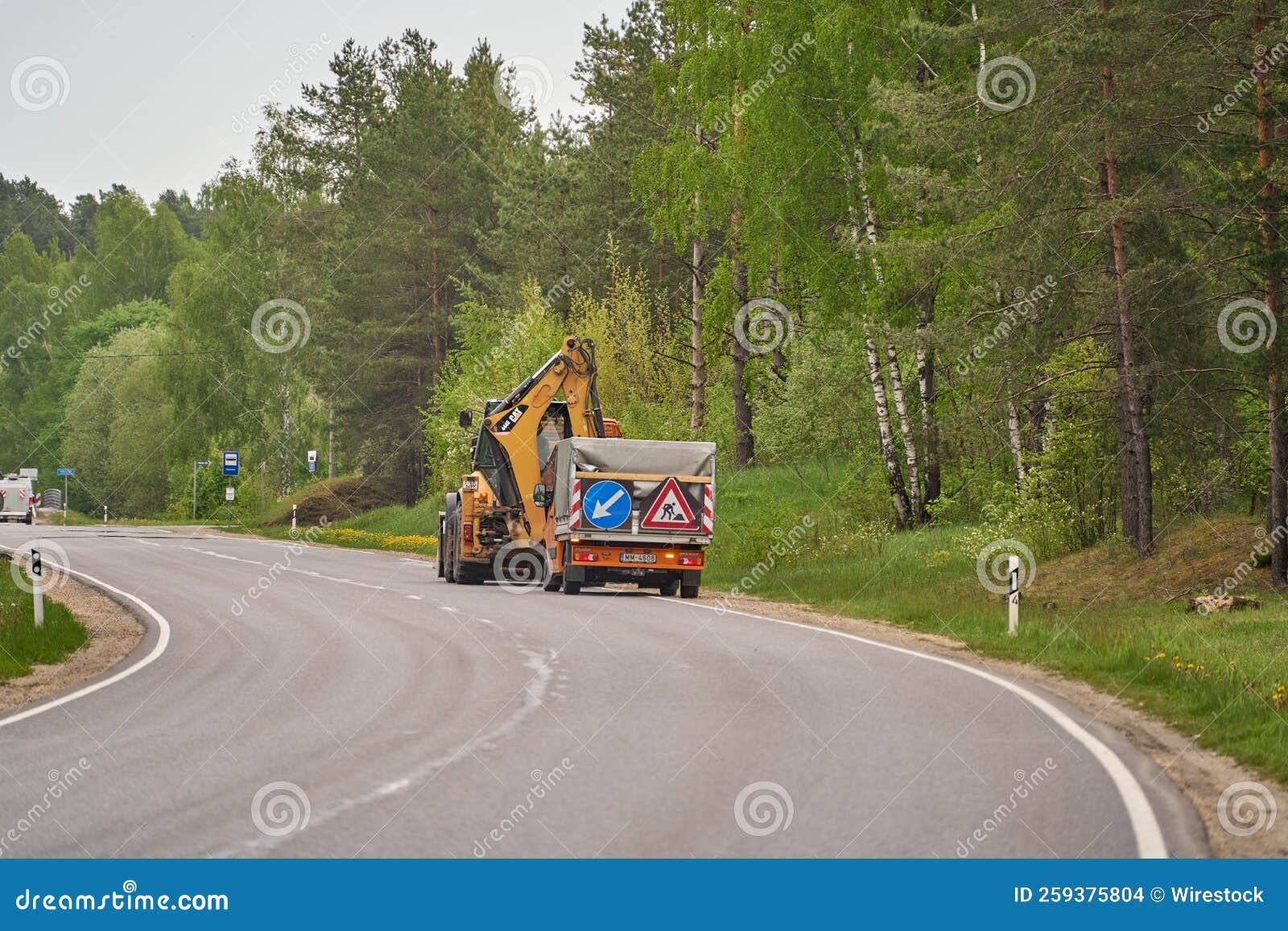 View of Road Repair Vehicles with Warning Signs on the Road Editorial ...