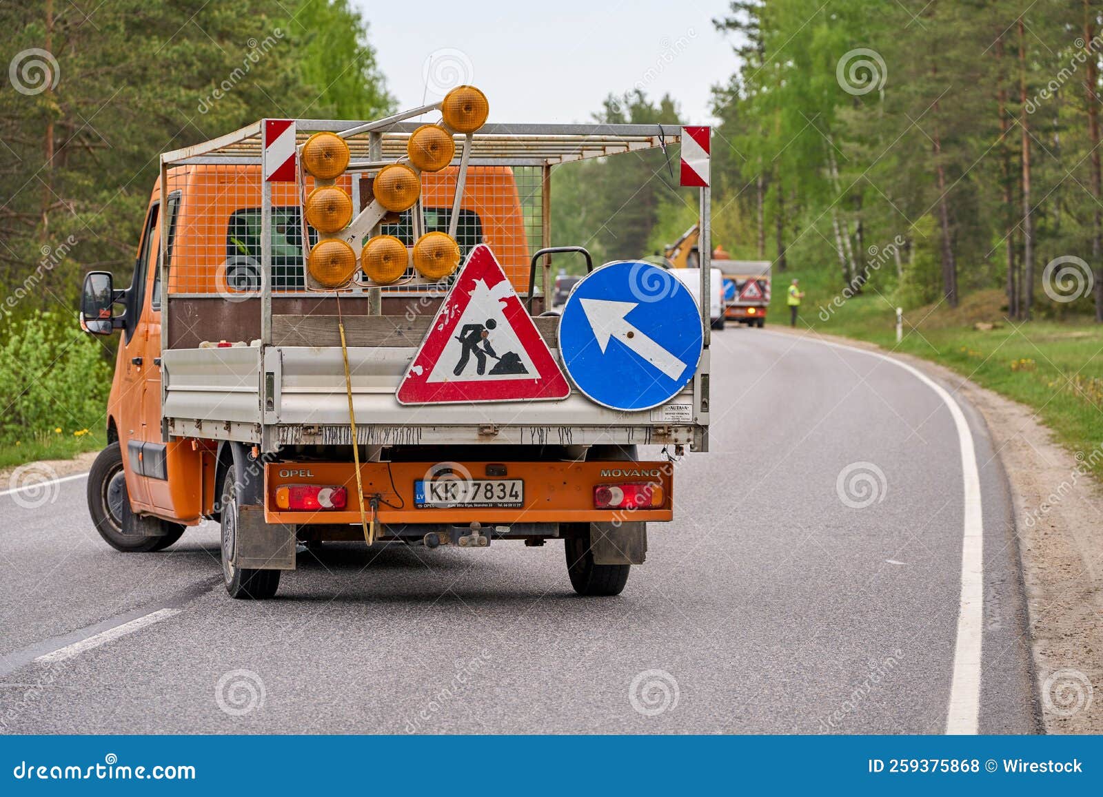 View of Road Repair Vehicles with Warning Signs on the Road Editorial ...