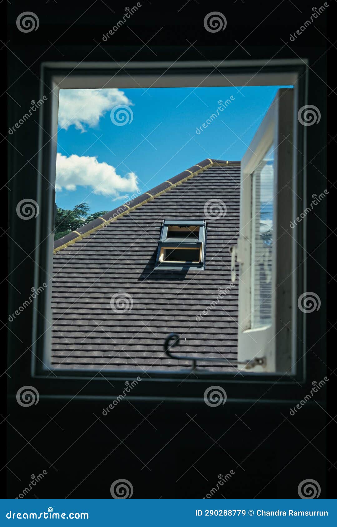View of Rooftop with Skylight from a Window Frame Stock Image - Image ...