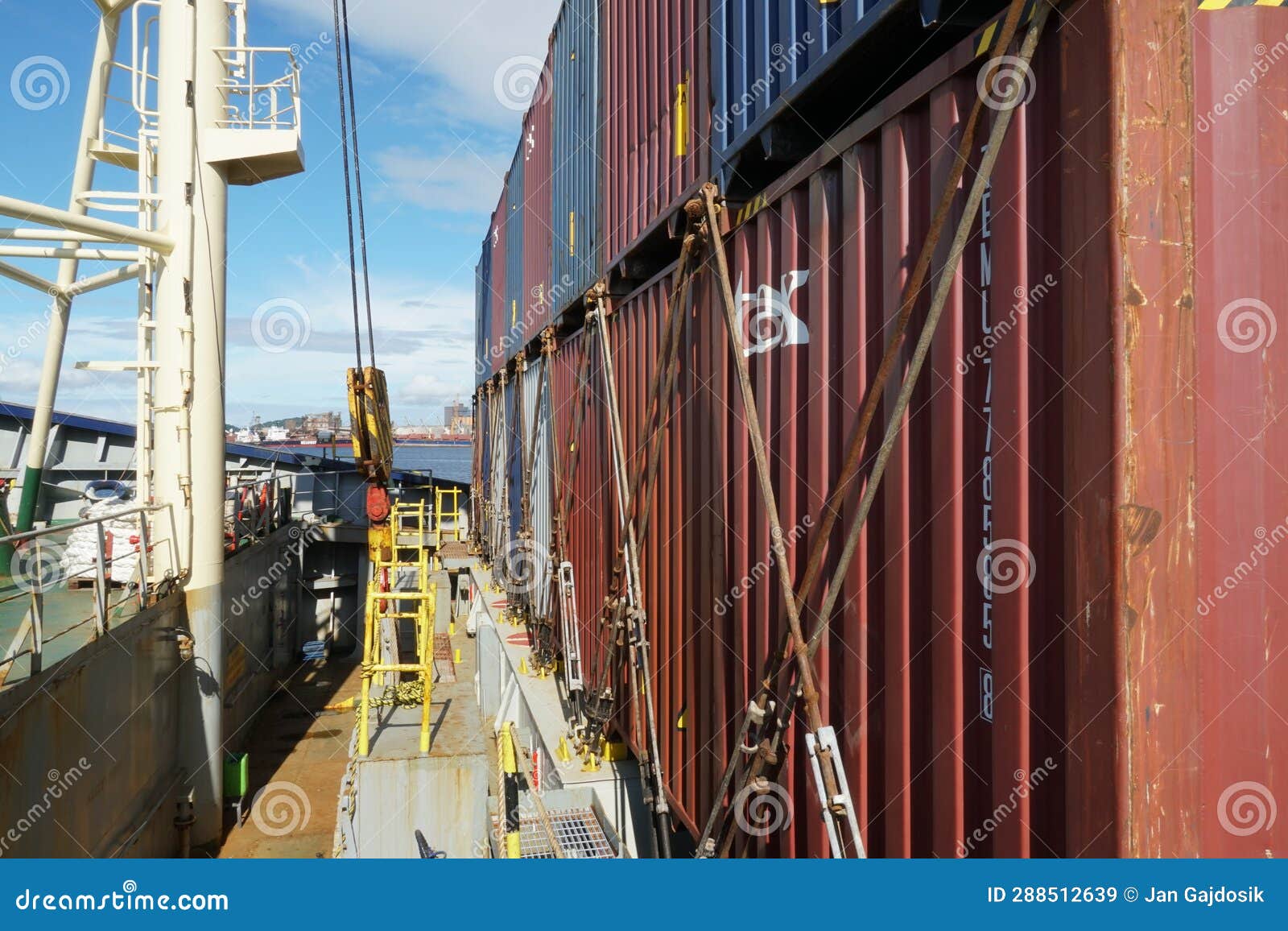 View on Row of Lashed Containers with Bars and Twist Locks from Forward ...