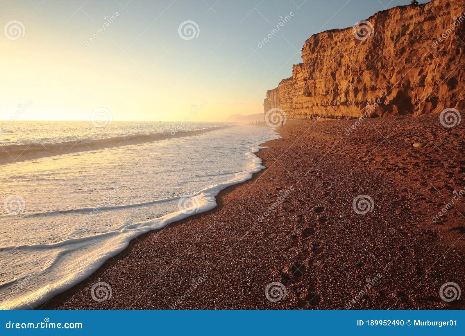 A View of a Sandy Beach with the Tide Retreating and Sandy Cliffs Stock ...