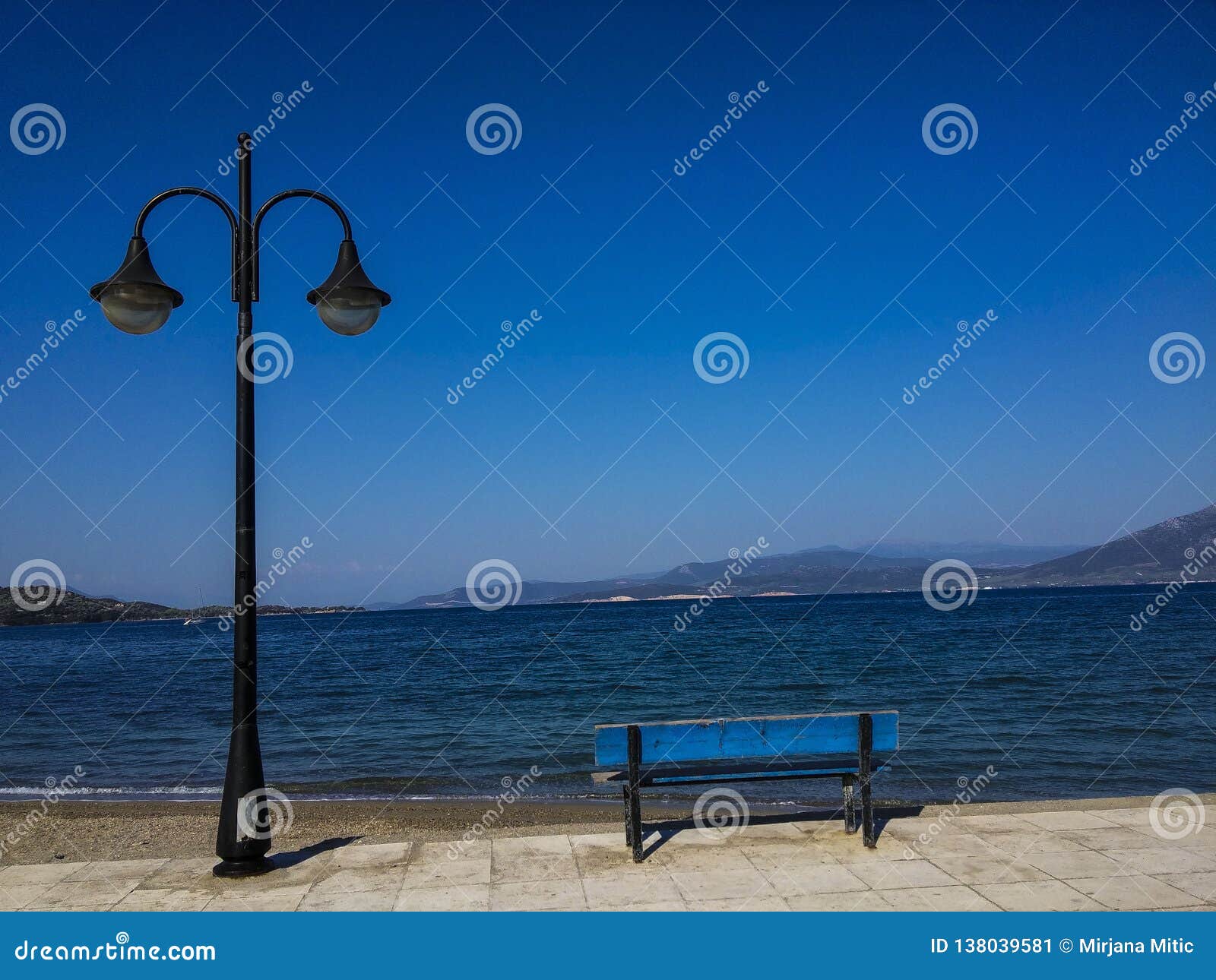 View of the sea and bench stock image. Image of summer - 138039581