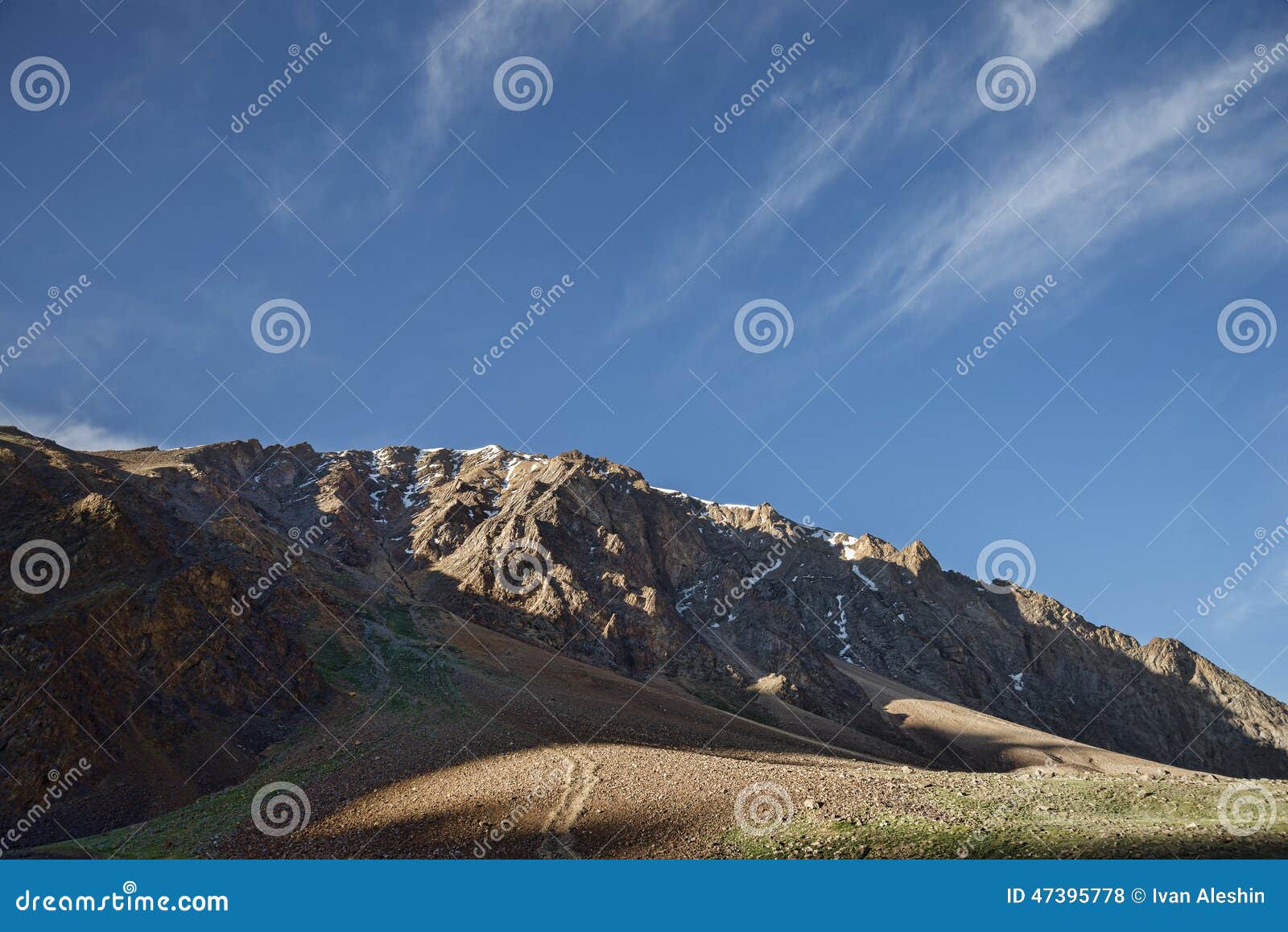 View of Shadowed Side Jagged Mountains with Snow Stock Photo - Image of ...