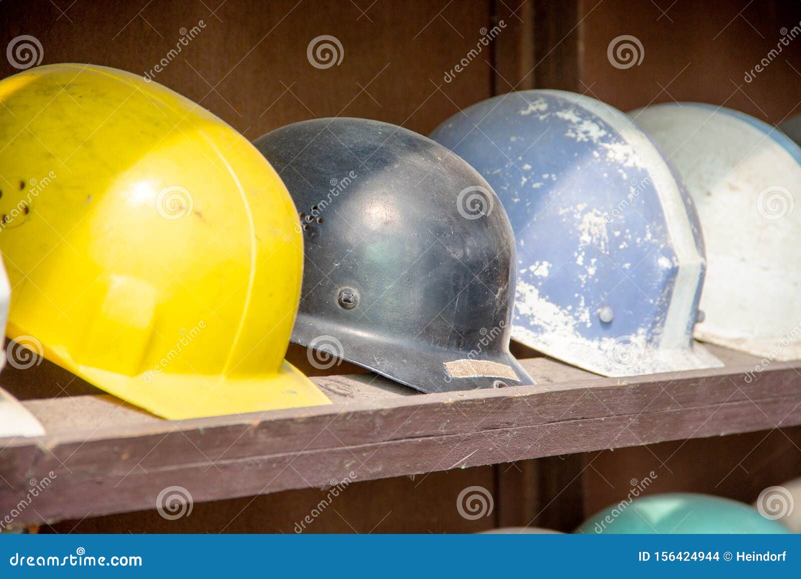 Shelf with work helmets stock photo. Image of tourism - 156424944